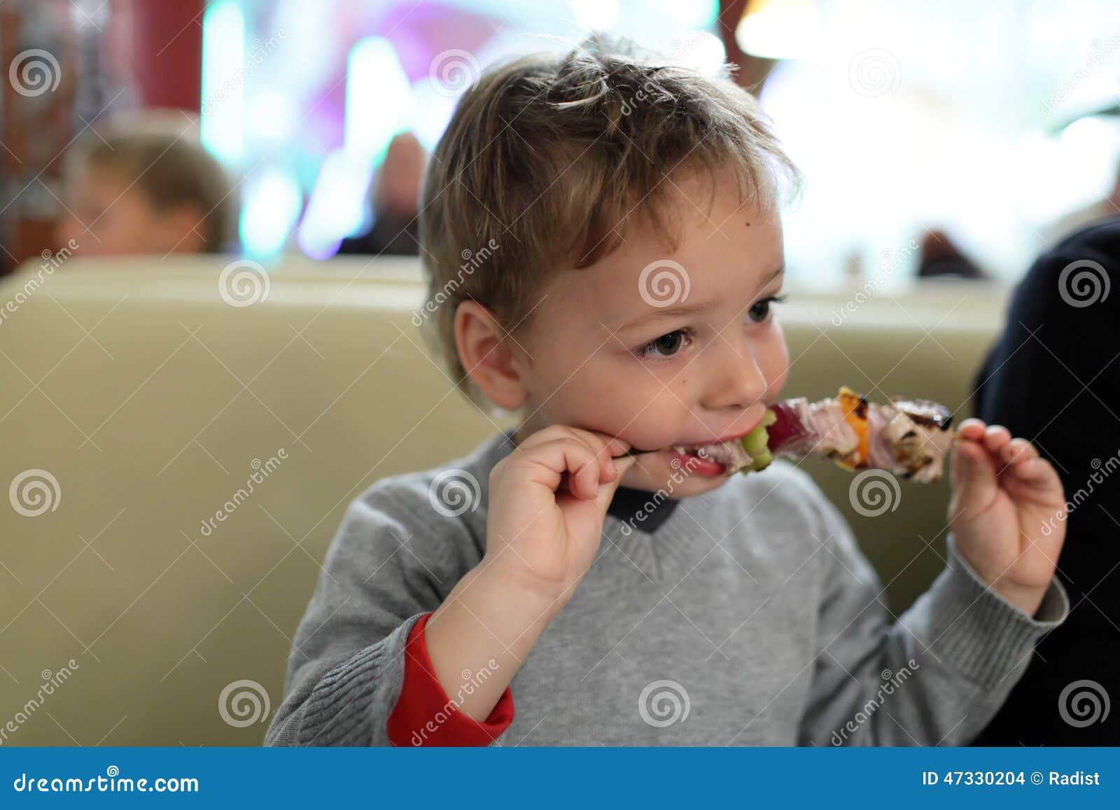 Boy eating kebab stock photo. Image of person, lunch - 47330204