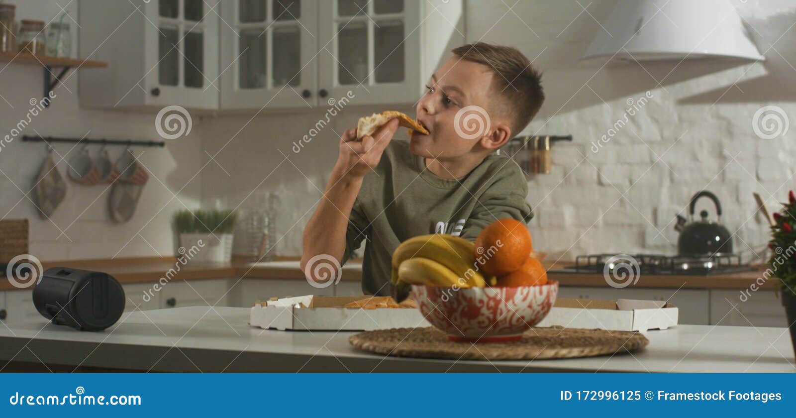Boy Eating in Kitchen Alone Stock Image - Image of eating, family ...