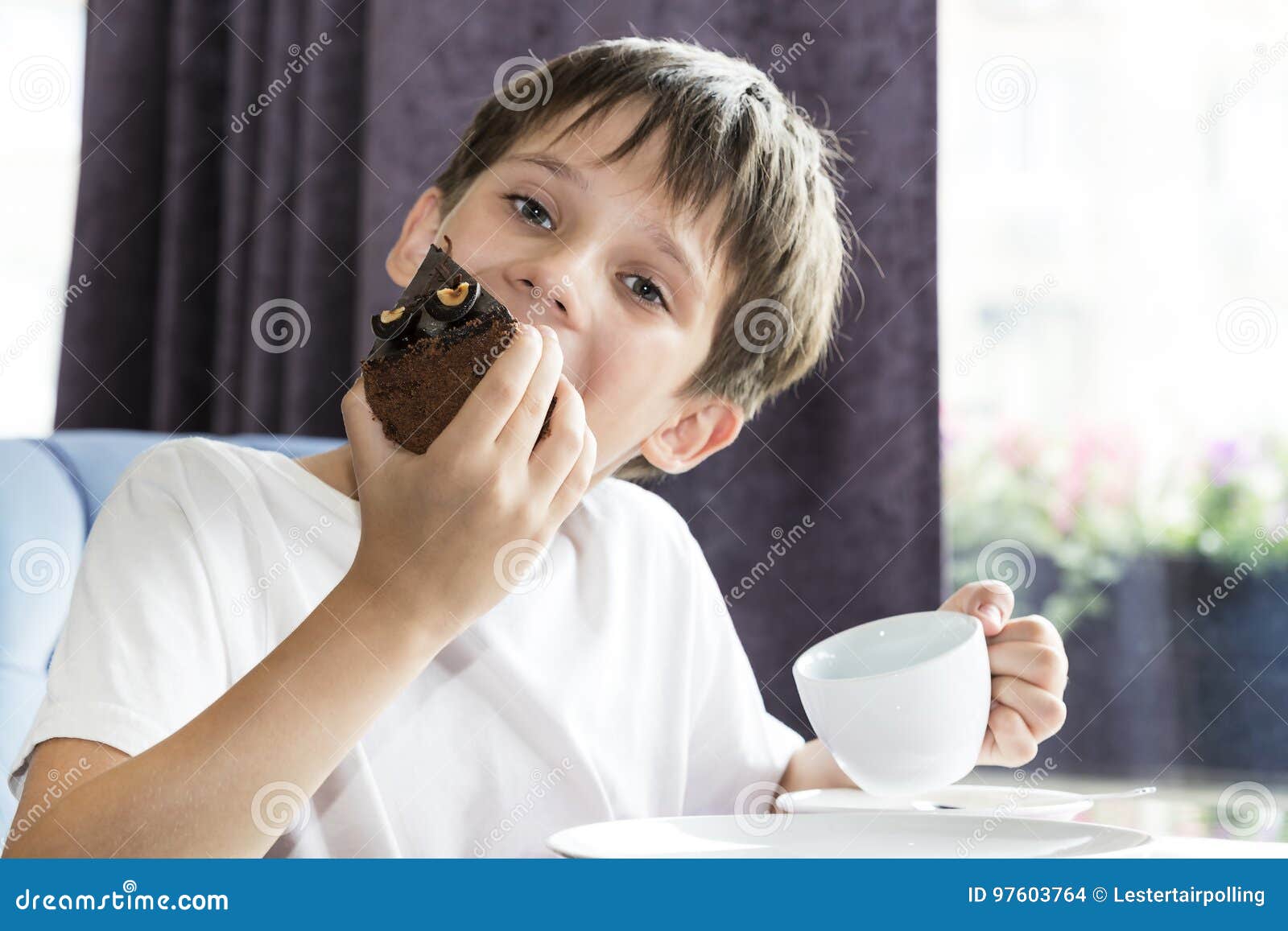 The Boy is Eating a Large Piece of Cake Stock Photo - Image of kids ...