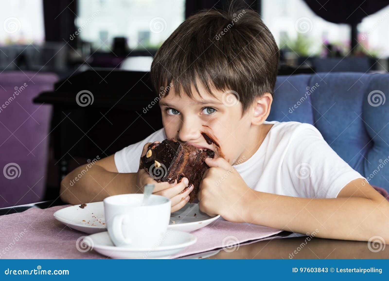 The Boy is Eating a Large Piece of Cake Stock Image - Image of eating ...