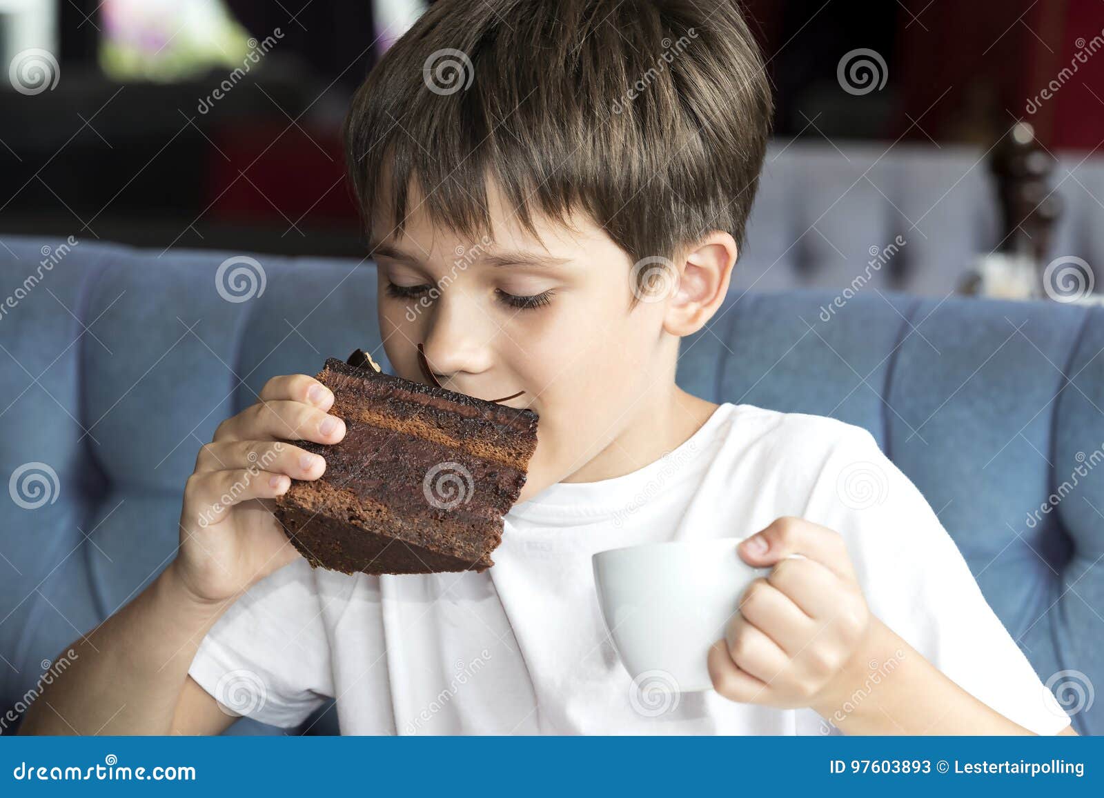 The Boy is Eating a Large Piece of Cake Stock Image - Image of mains ...