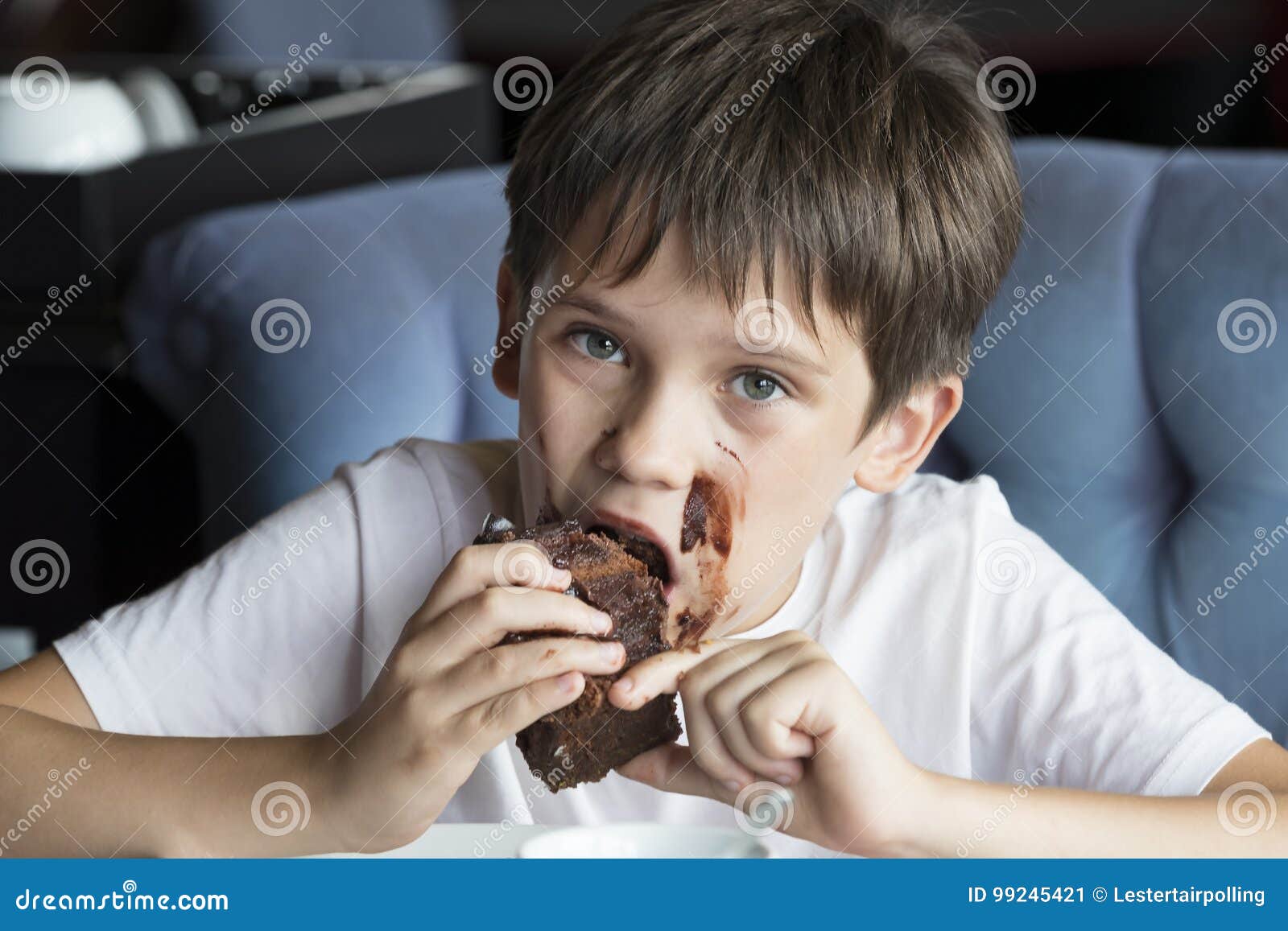 The Boy is Eating a Large Piece of Cake Stock Image - Image of ...