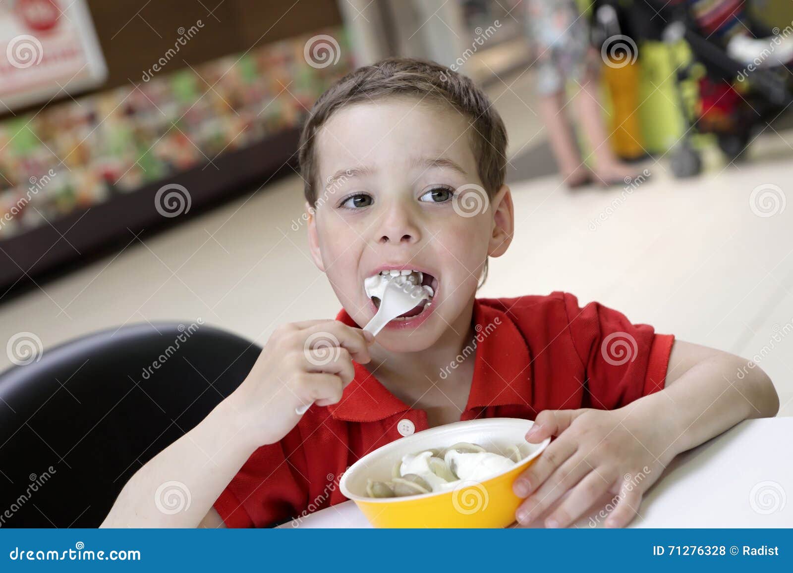 Boy Eating Meat Dumplings with Sour Cream Stock Photo - Image of meal ...