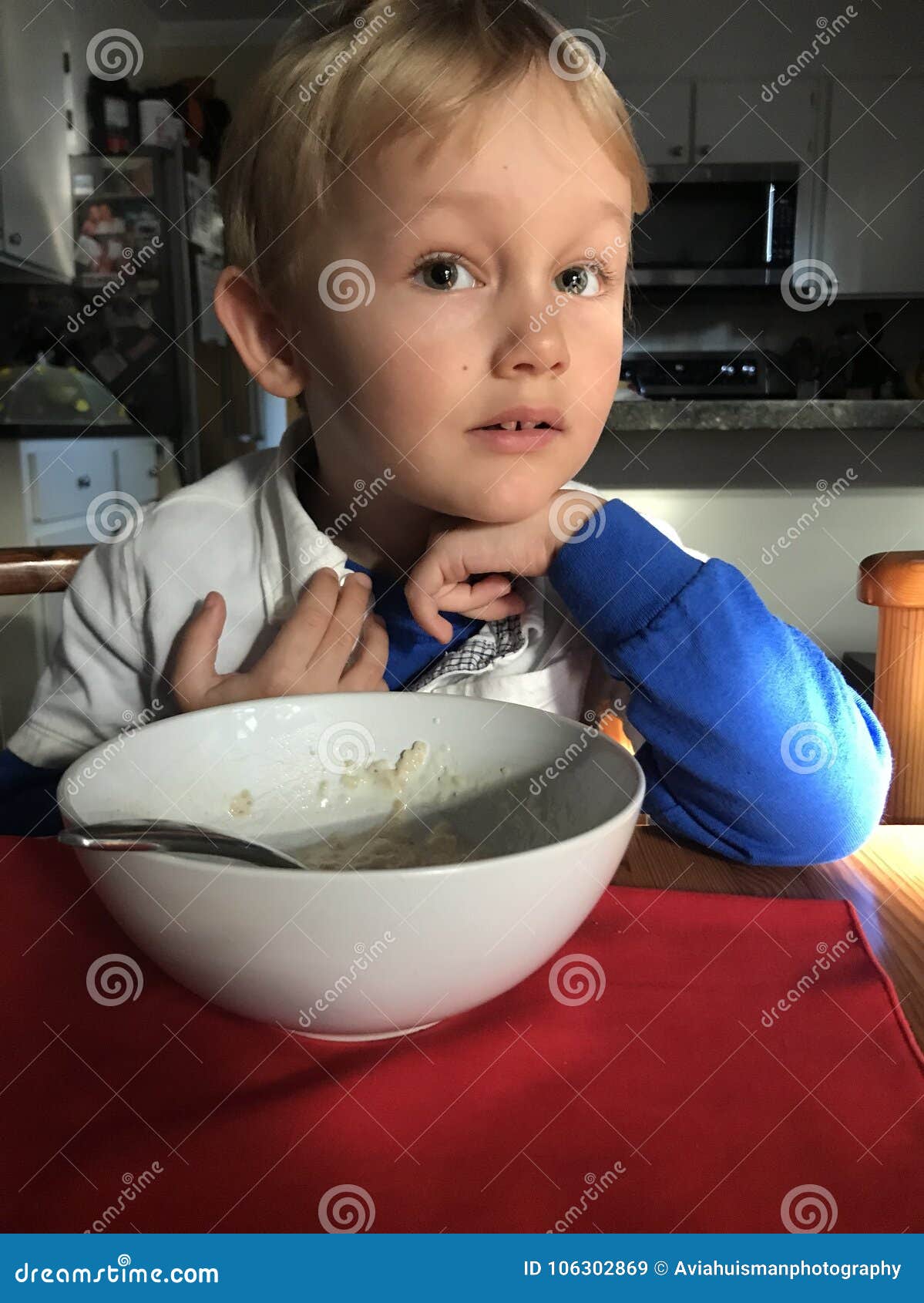 Cute Boy with Large Eyes Eating Stock Image - Image of male, happy ...