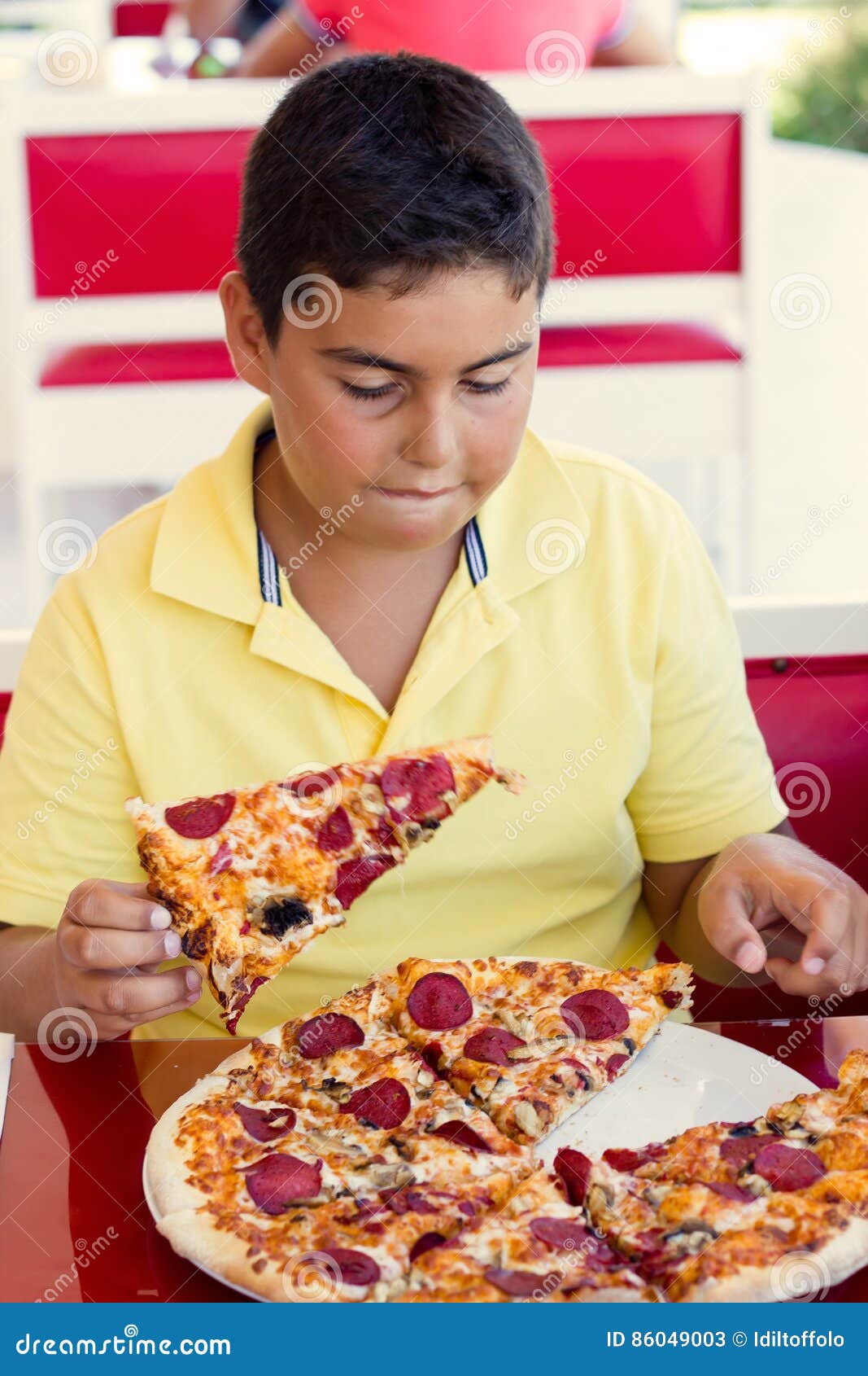 Boy is Eating Pizza stock image. Image of destinations - 86049003