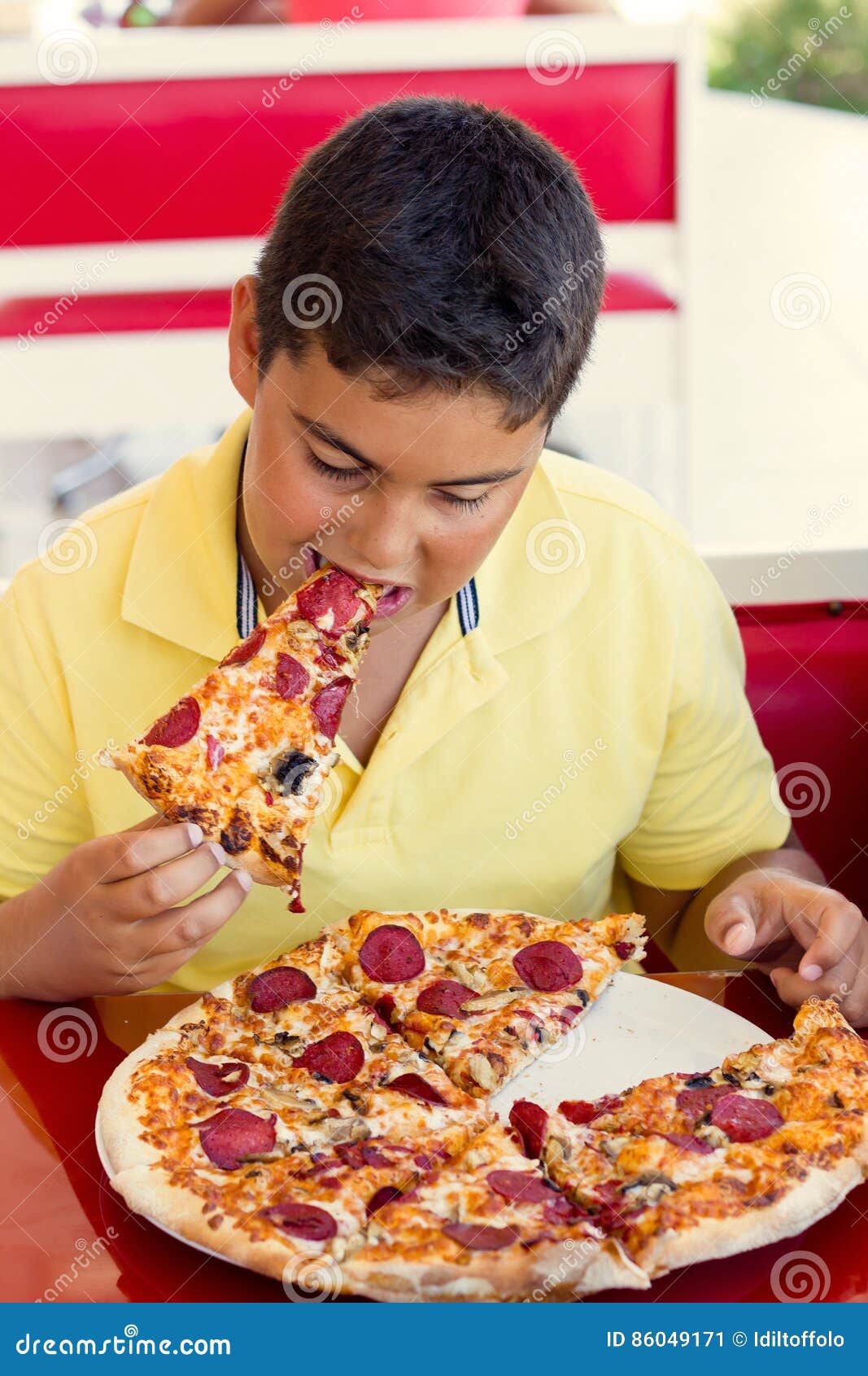 Boy is Eating Pizza stock image. Image of child, elegance - 86049171