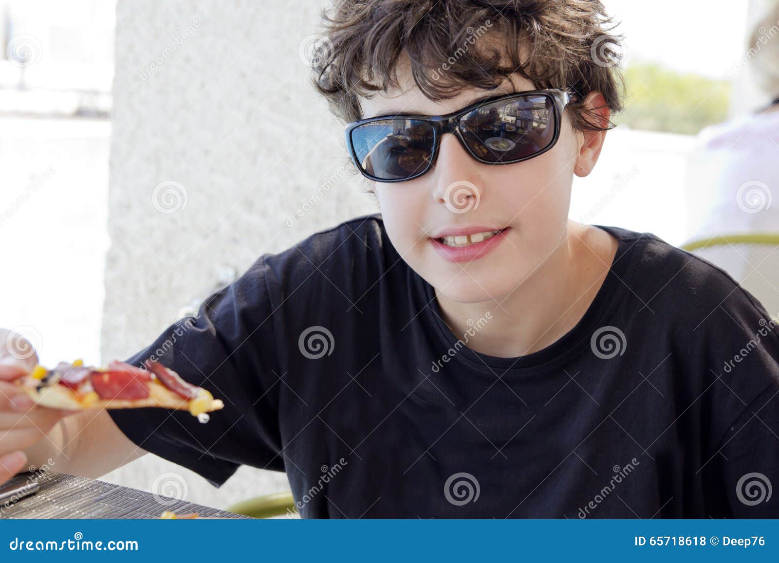 The boy is eating pizza stock photo. Image of pizza, child - 65718618