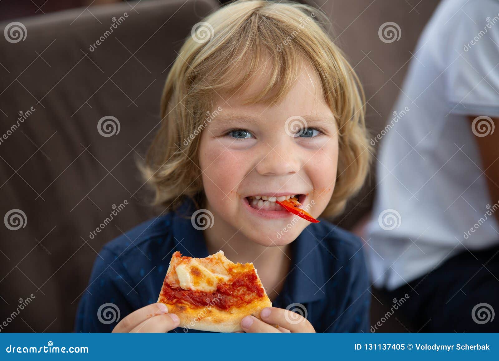 The Boy is Eating Pizza in an Italian Restaurant Stock Image - Image of ...