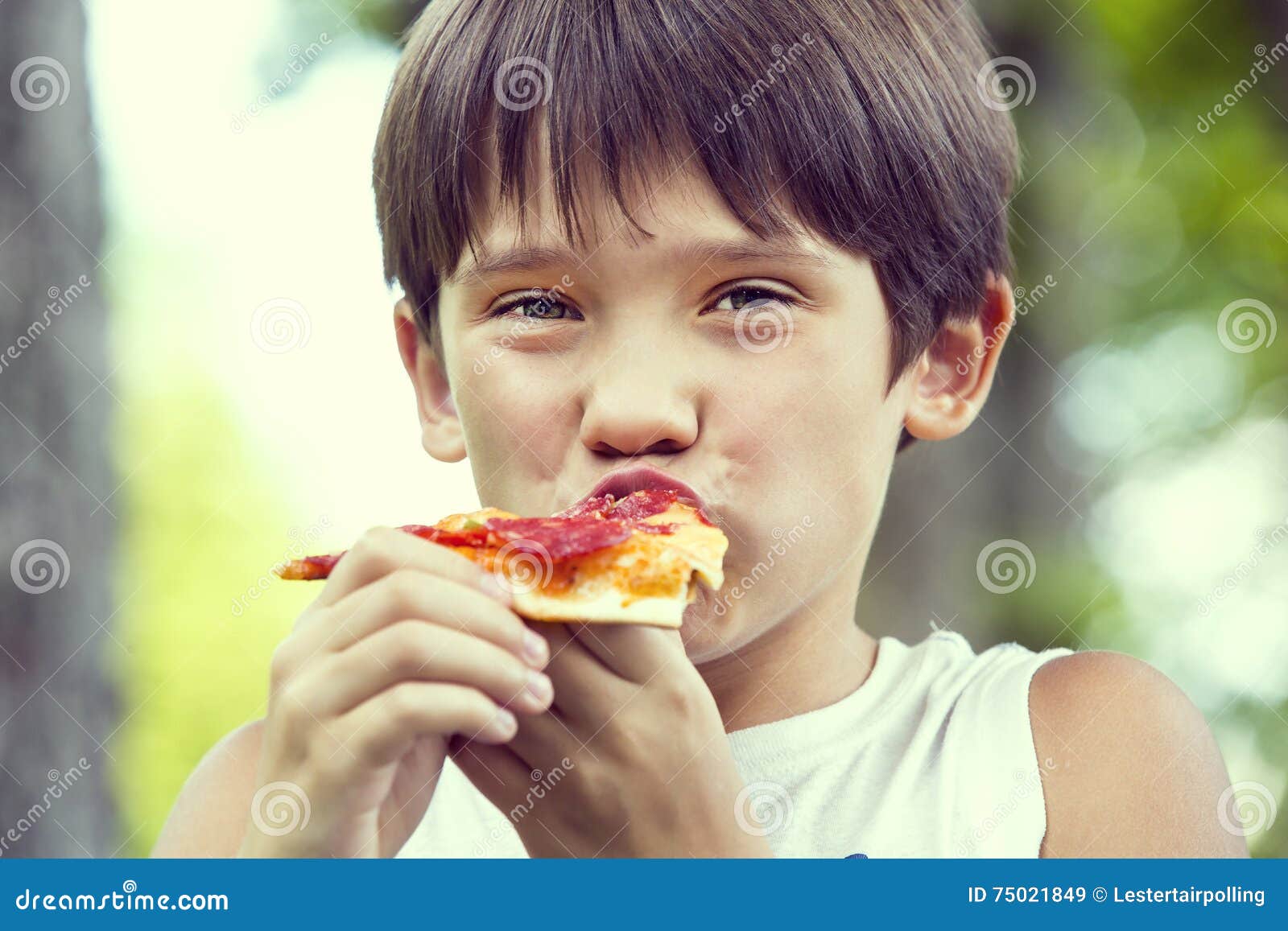 Boy eating pizza stock image. Image of elementary, children - 75021849