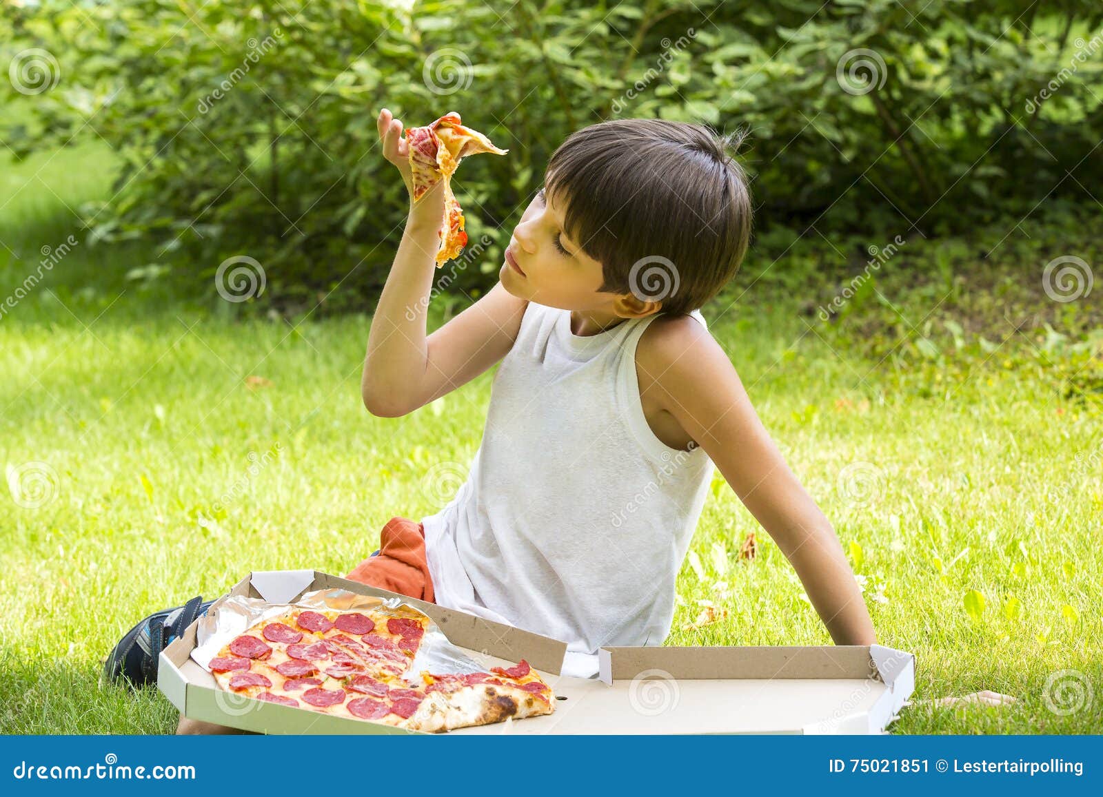 Boy eating pizza stock image. Image of childhood, tasty - 75021851