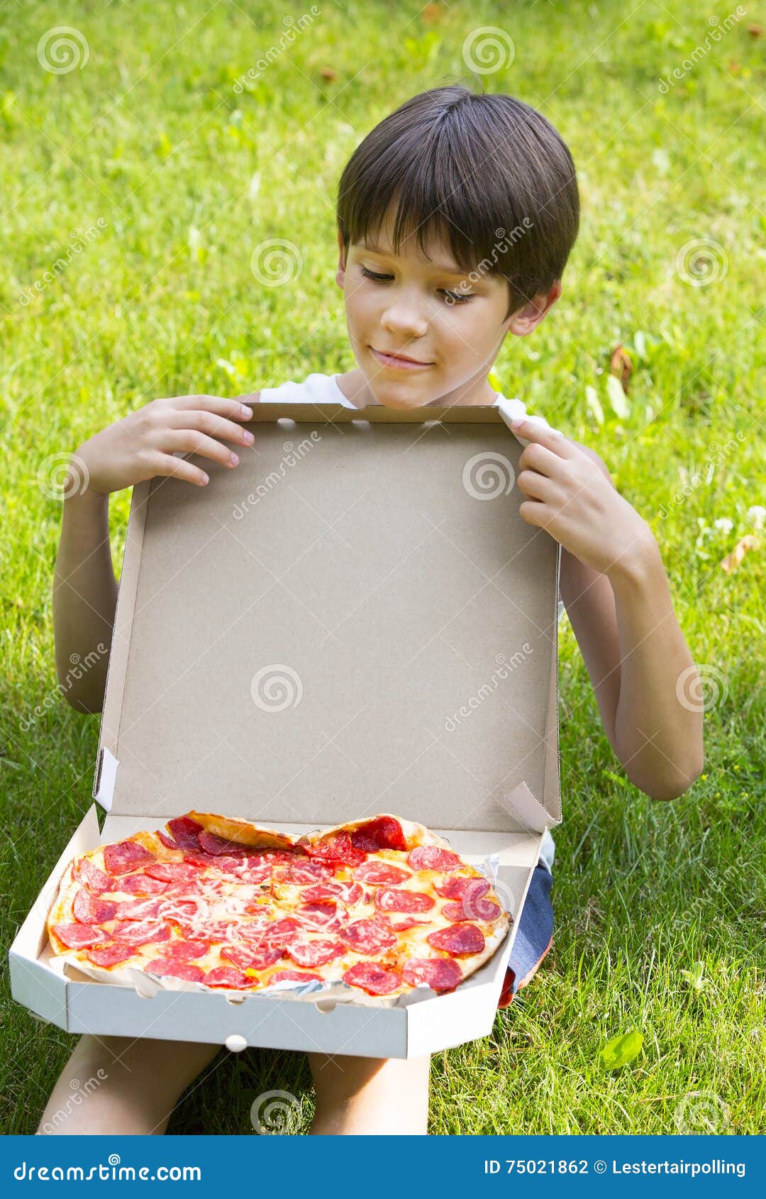Boy eating pizza stock photo. Image of pizzeria, children - 75021862