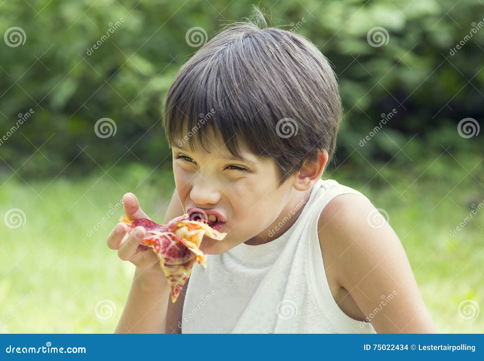 Boy eating pizza stock photo. Image of cafe, person, elementary - 75022434
