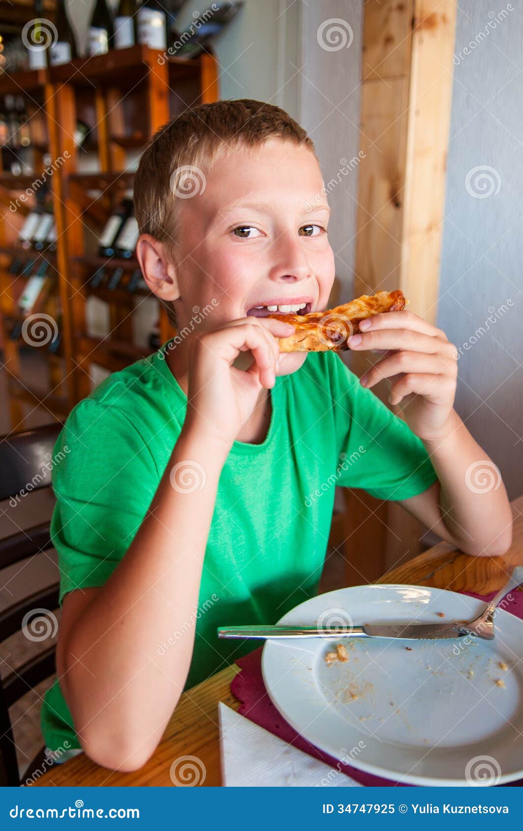 Boy eating pizza stock image. Image of people, cafe, preadolescent ...