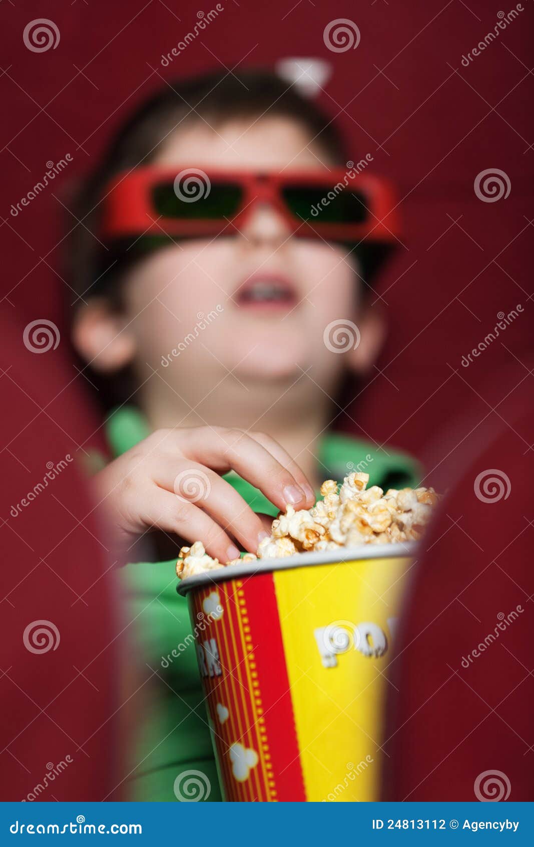 A boy eating popcorn stock photo. Image of films, seats - 24813112