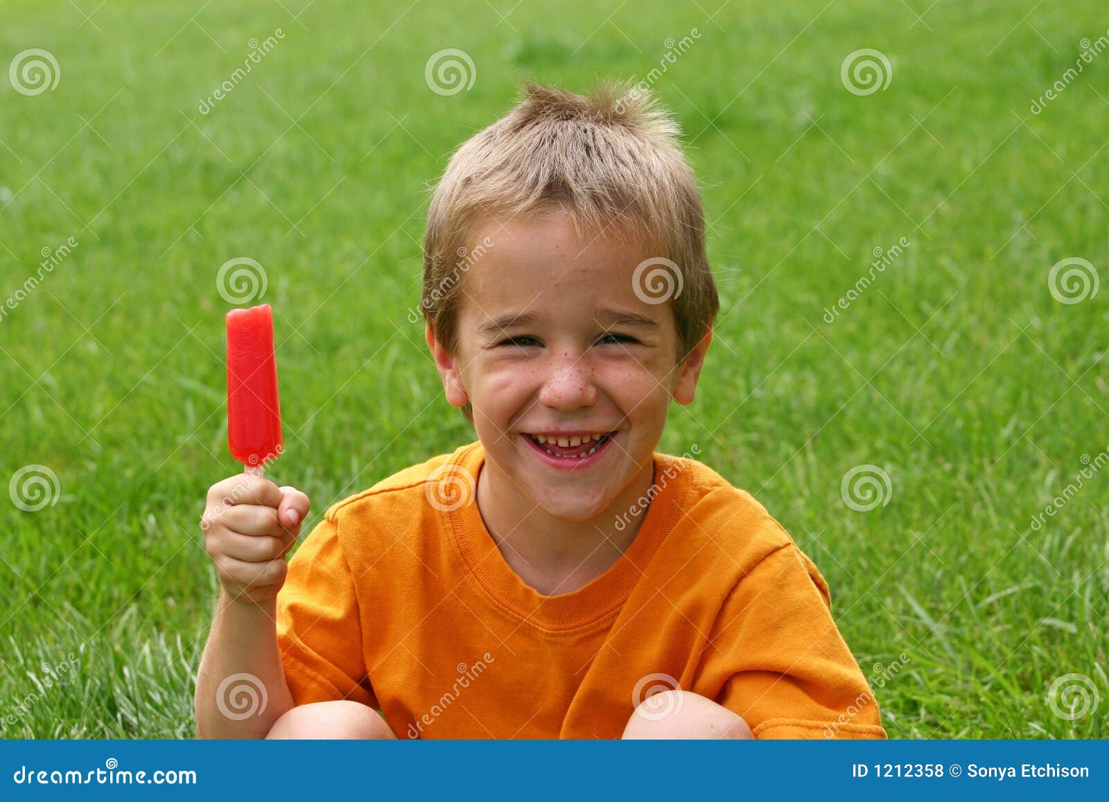 Boy Eating Popsicle stock photo. Image of face, happy - 1212358