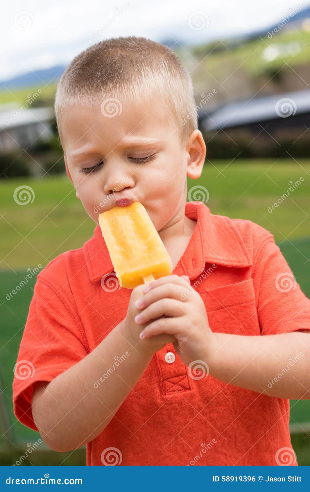 Boy Eating Popsicle Stock Photo - Image: 58919396