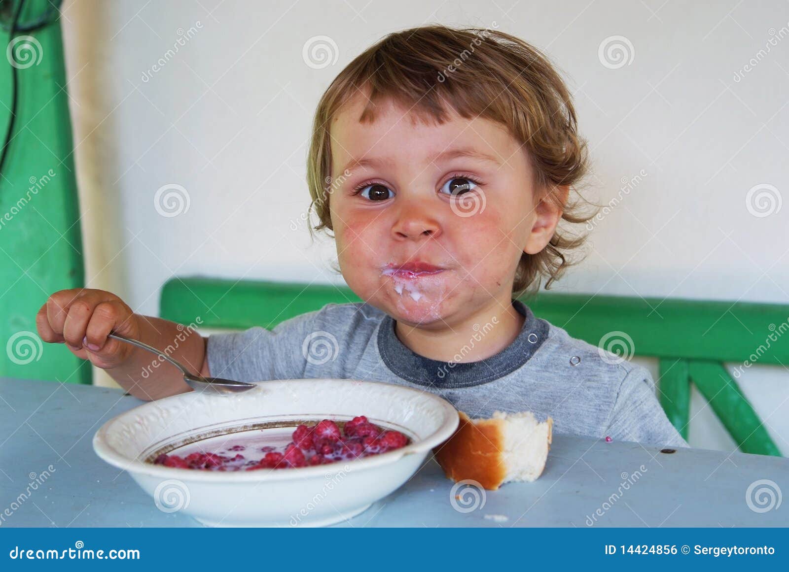 Boy Eating Raspberry with Milk Stock Photo - Image of milk, beautiful ...