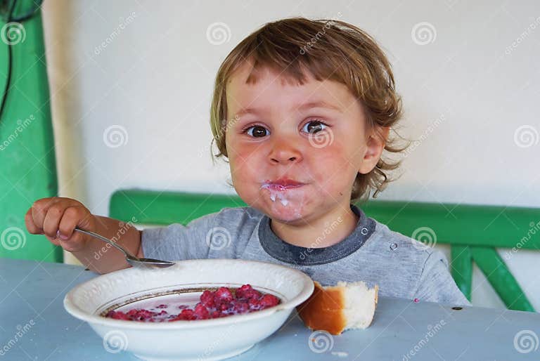 Boy Eating Raspberry with Milk Stock Photo - Image of milk, beautiful ...