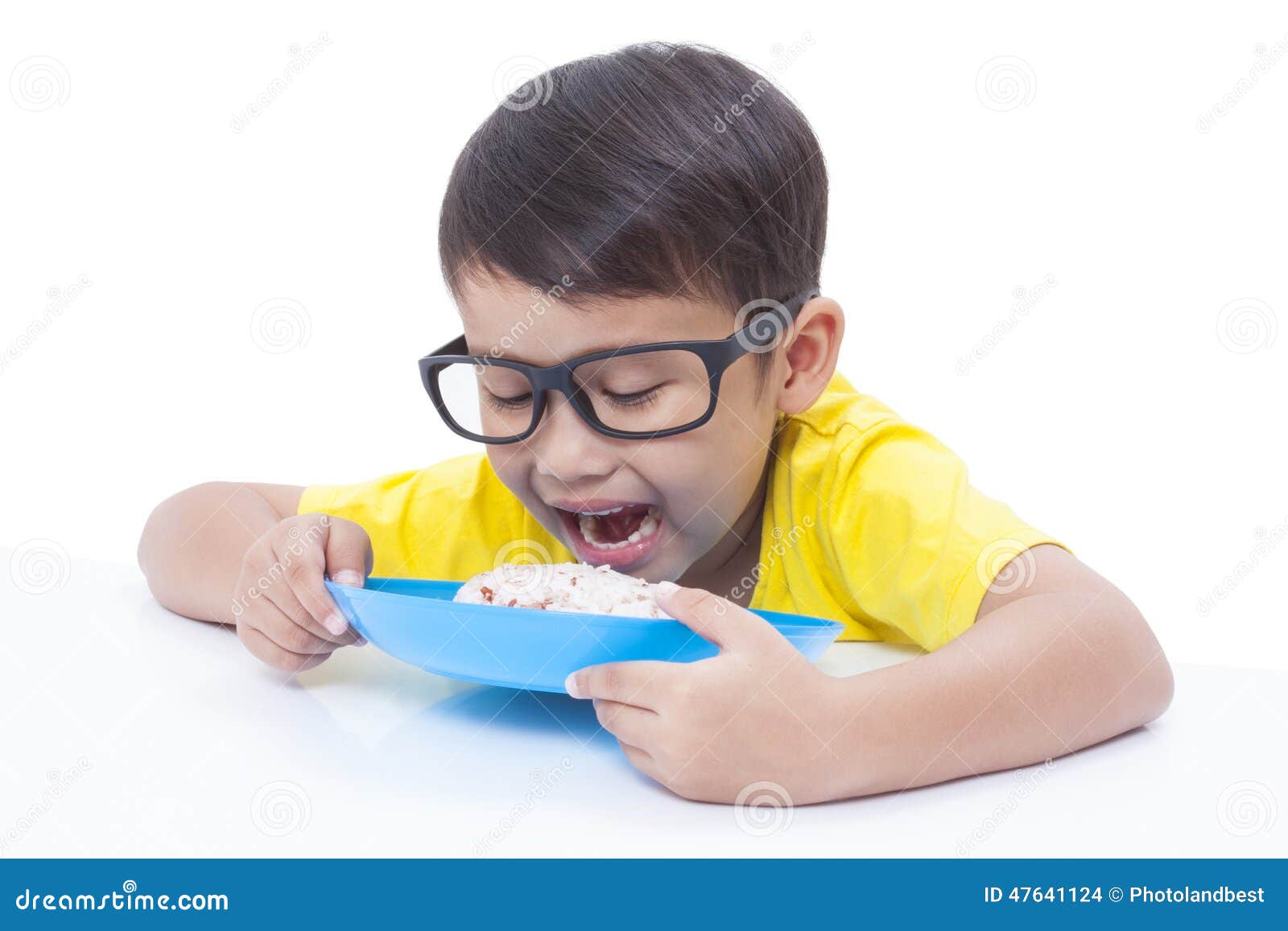 Boy eating rice. stock photo. Image of spoon, interior - 47641124