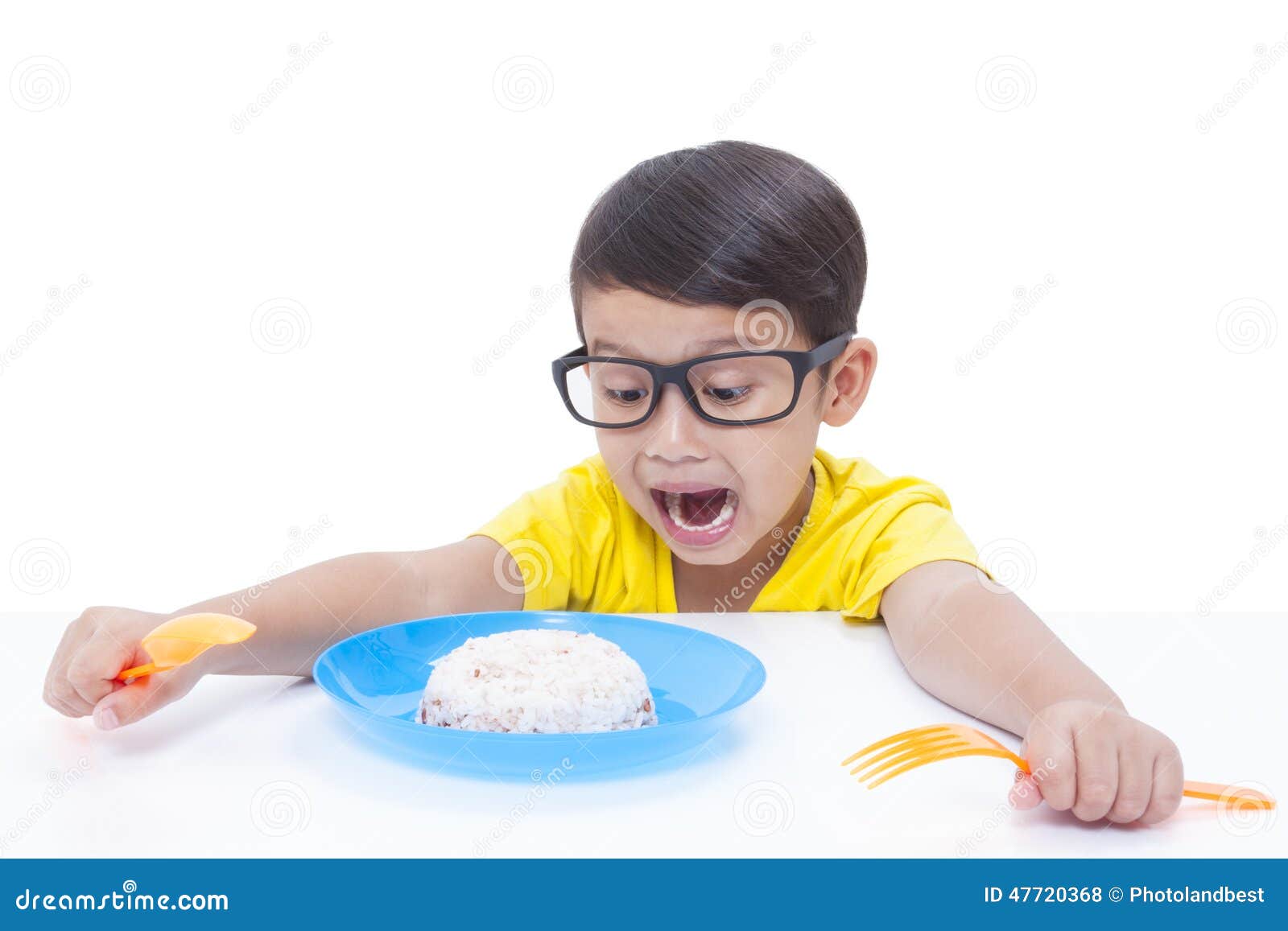 Boy eating rice. stock photo. Image of smile, breakfast - 47720368