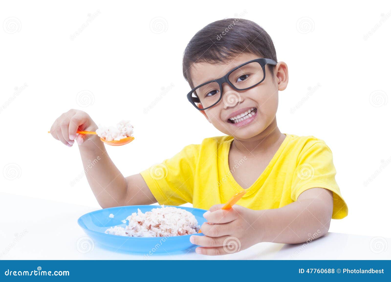 Boy eating rice. stock photo. Image of asia, food, bored - 47760688