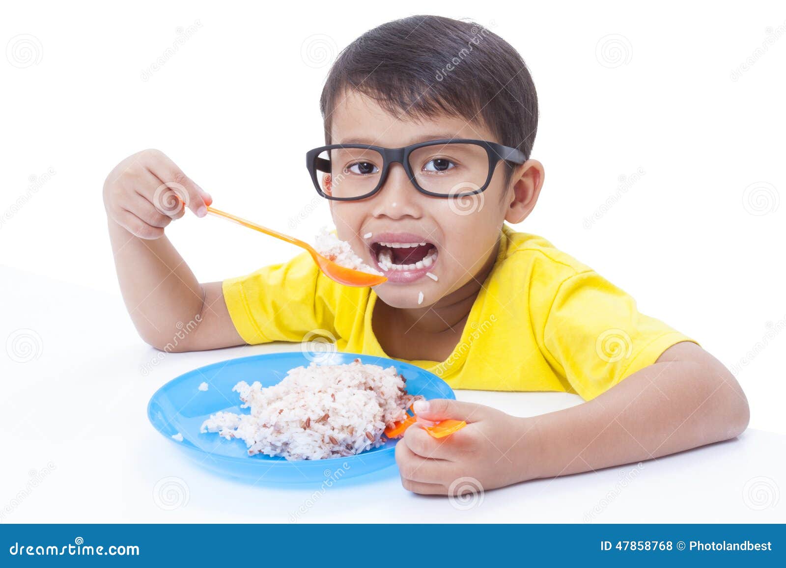 Boy eating rice. stock photo. Image of food, delicious - 47858768