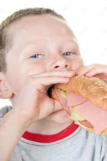 Boy eating sandwich stock image. Image of meal, appetite - 20755759