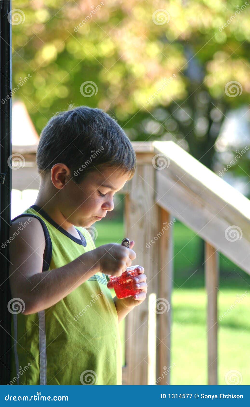 Boy Eating a Snack stock image. Image of food, green, happy - 1314577