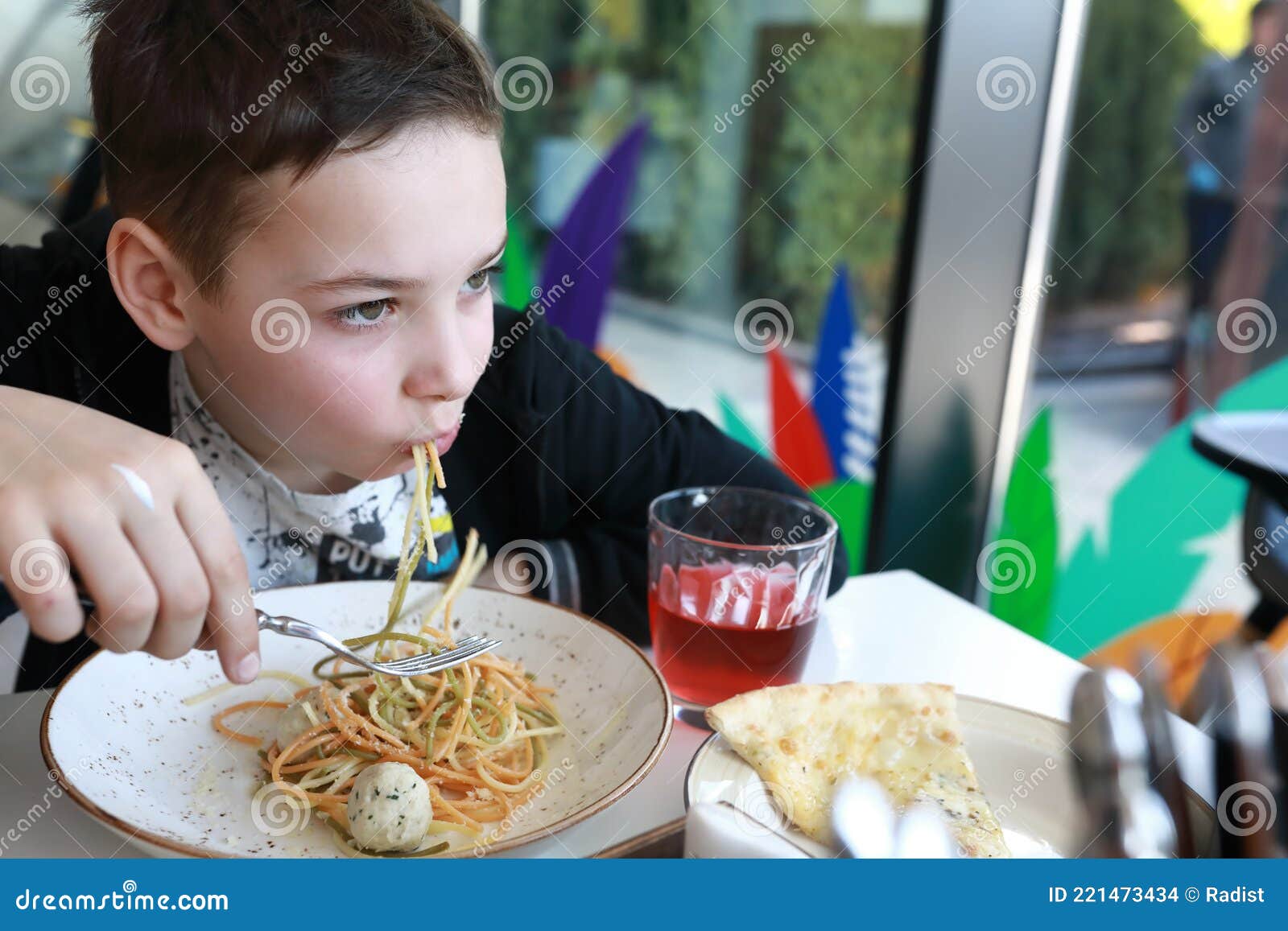 Boy Eating Spaghetti with Chicken Meatballs Stock Photo - Image of ...