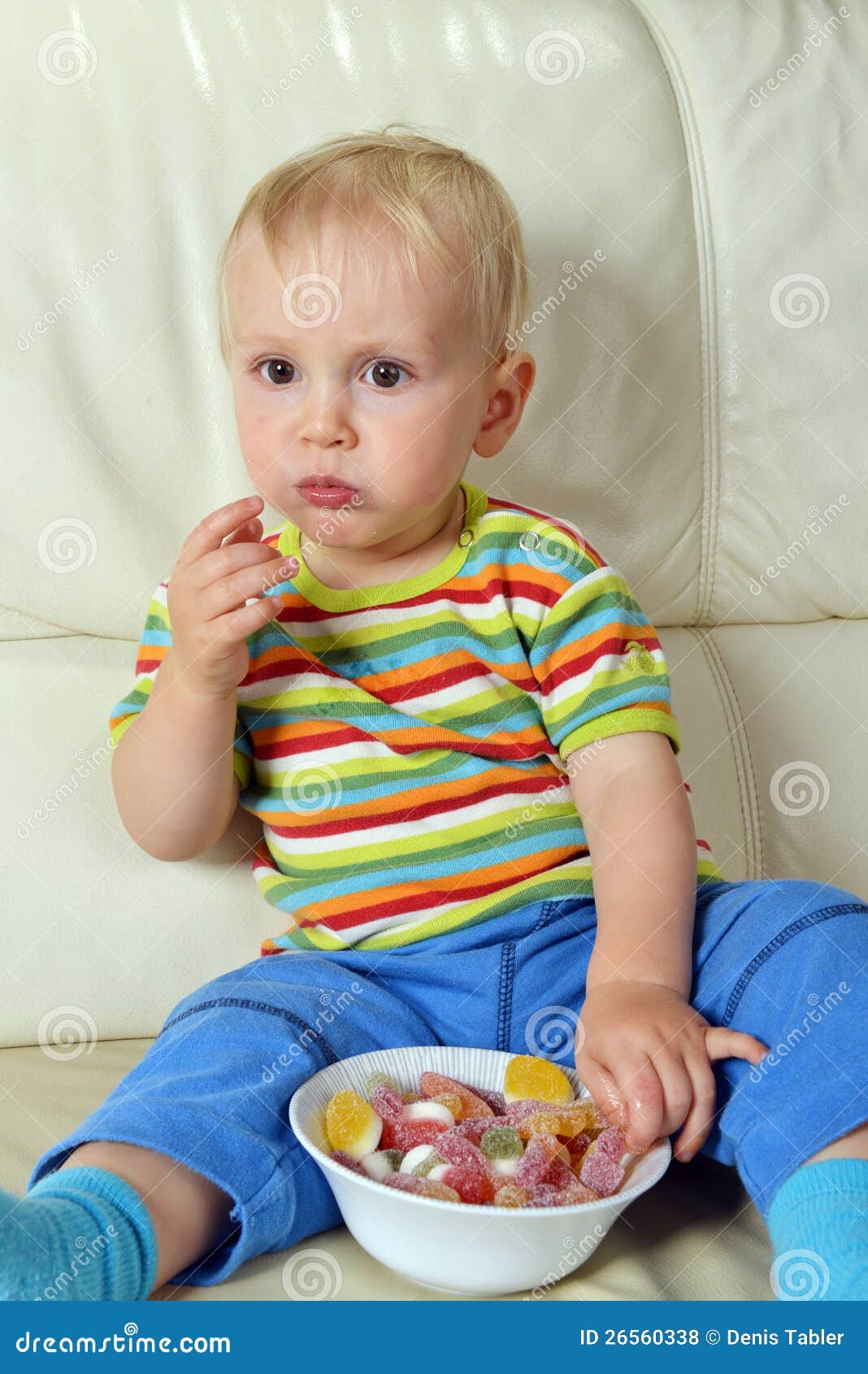 Boy eating sweets stock photo. Image of sofa, happy, diet - 26560338