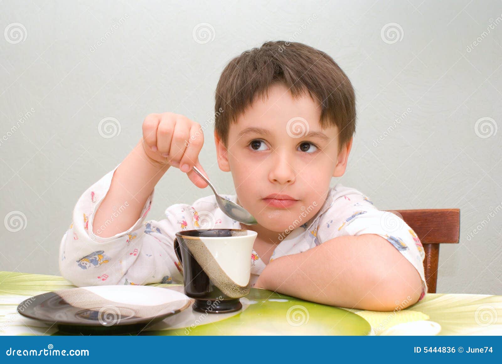 Boy eating at table stock photo. Image of youth, youthful - 5444836