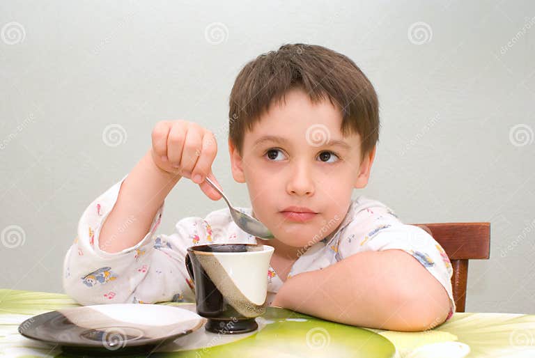 Boy eating at table stock photo. Image of youth, youthful - 5444836