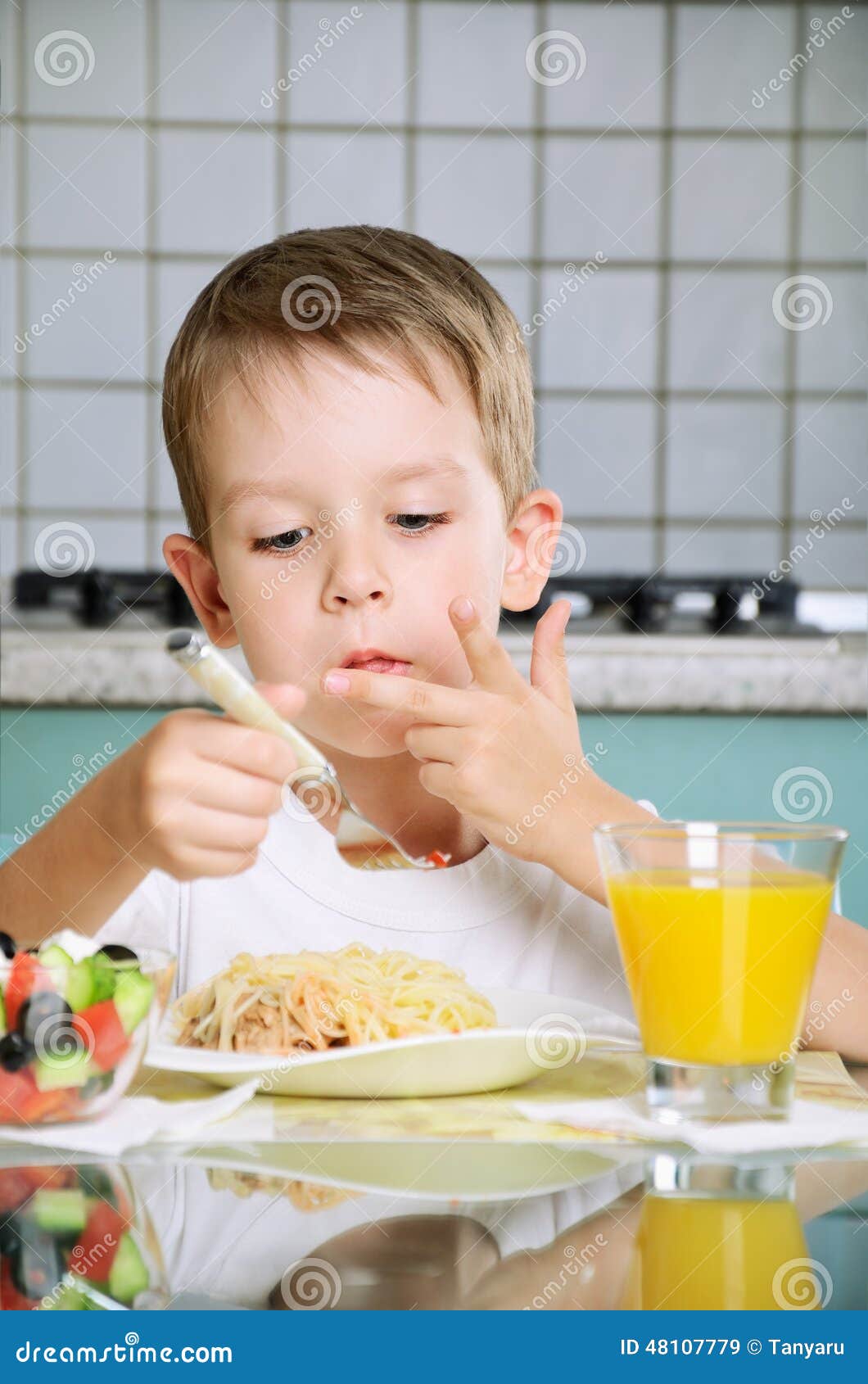 Boy Eating at the Table Vertical Stock Image - Image of bowl, eating ...