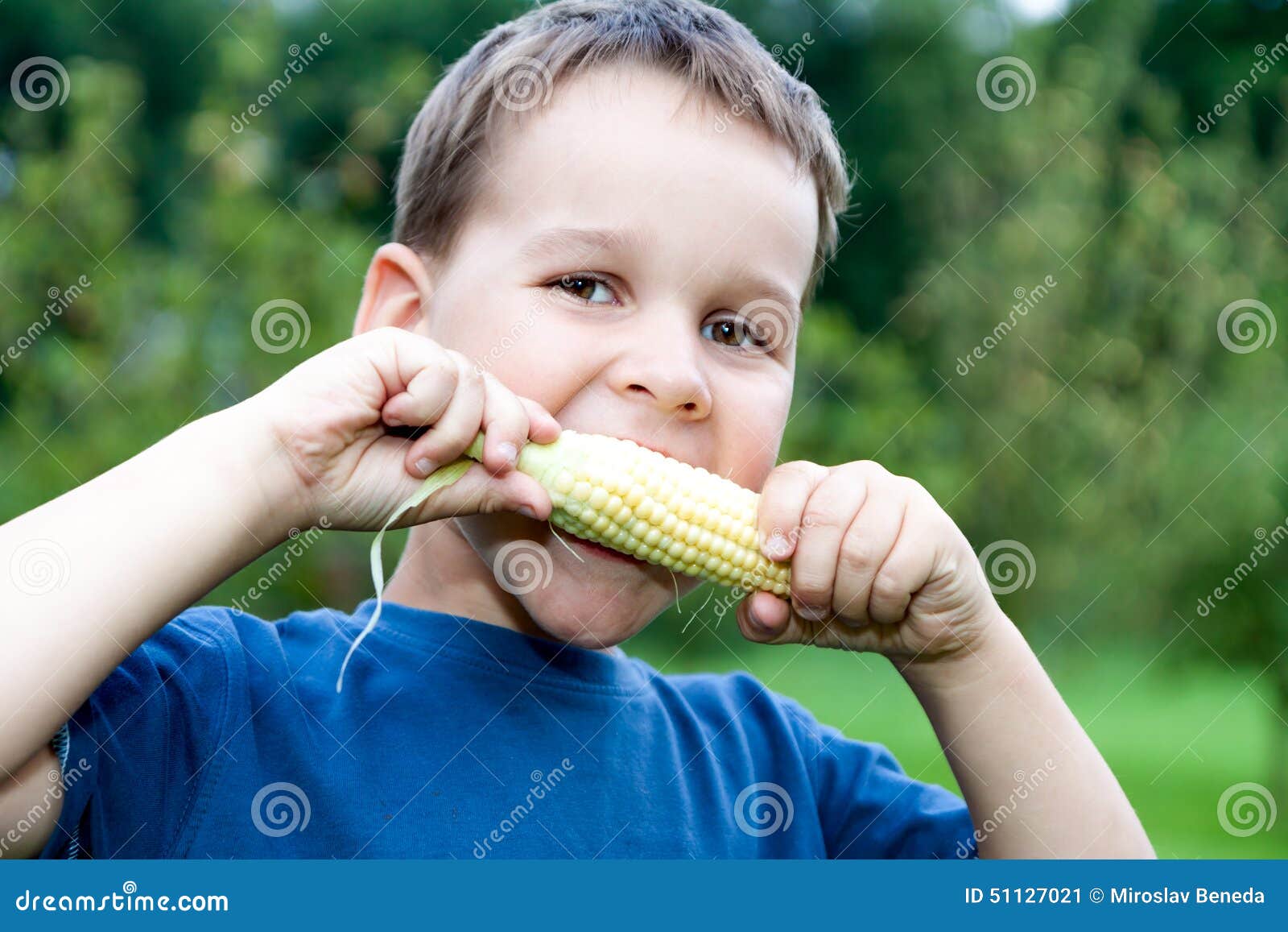Boy eating young corn stock image. Image of healthy, summer - 51127021