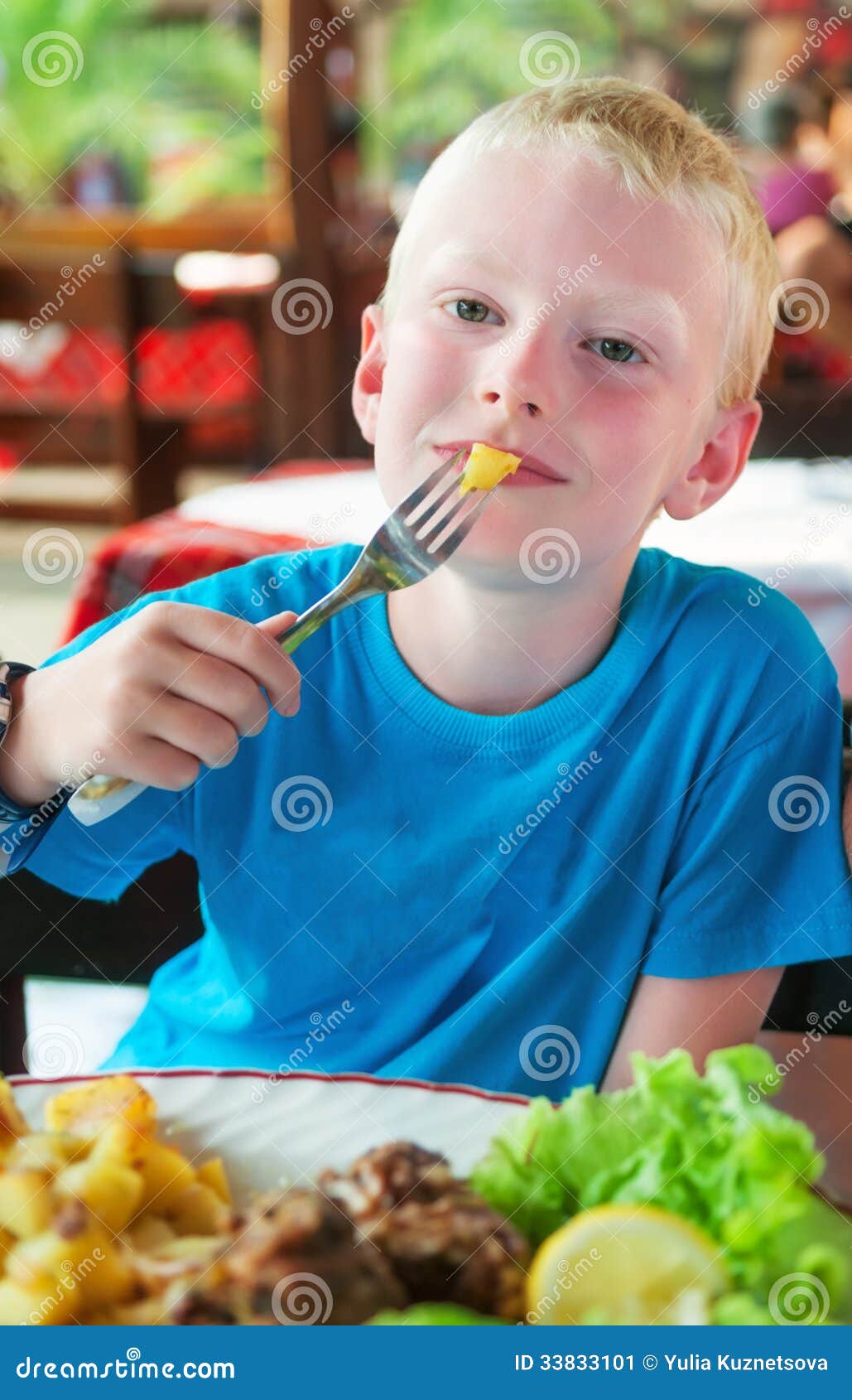 Boy eating stock image. Image of male, caucasian, blue - 33833101