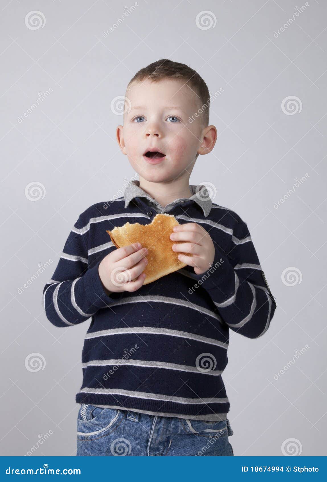 Boy eats bread stock photo. Image of little, hungry, portrait - 18674994