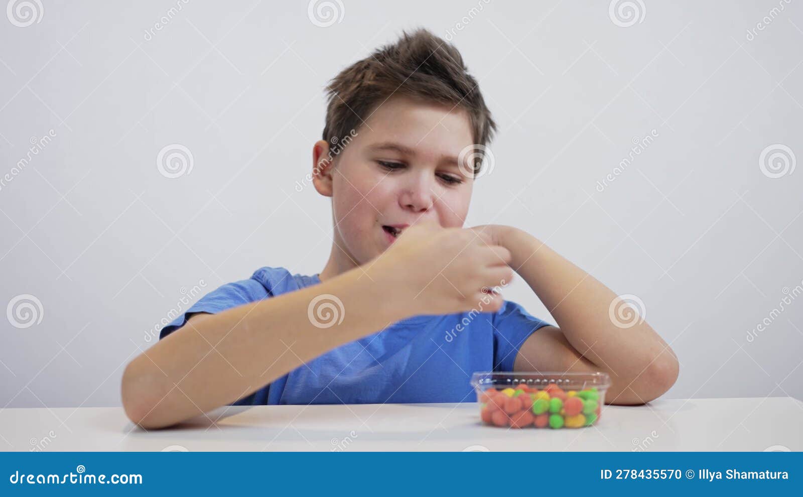 Boy Eats Candy on White Background Stock Footage - Video of unhealthy, confectionery: 278435570