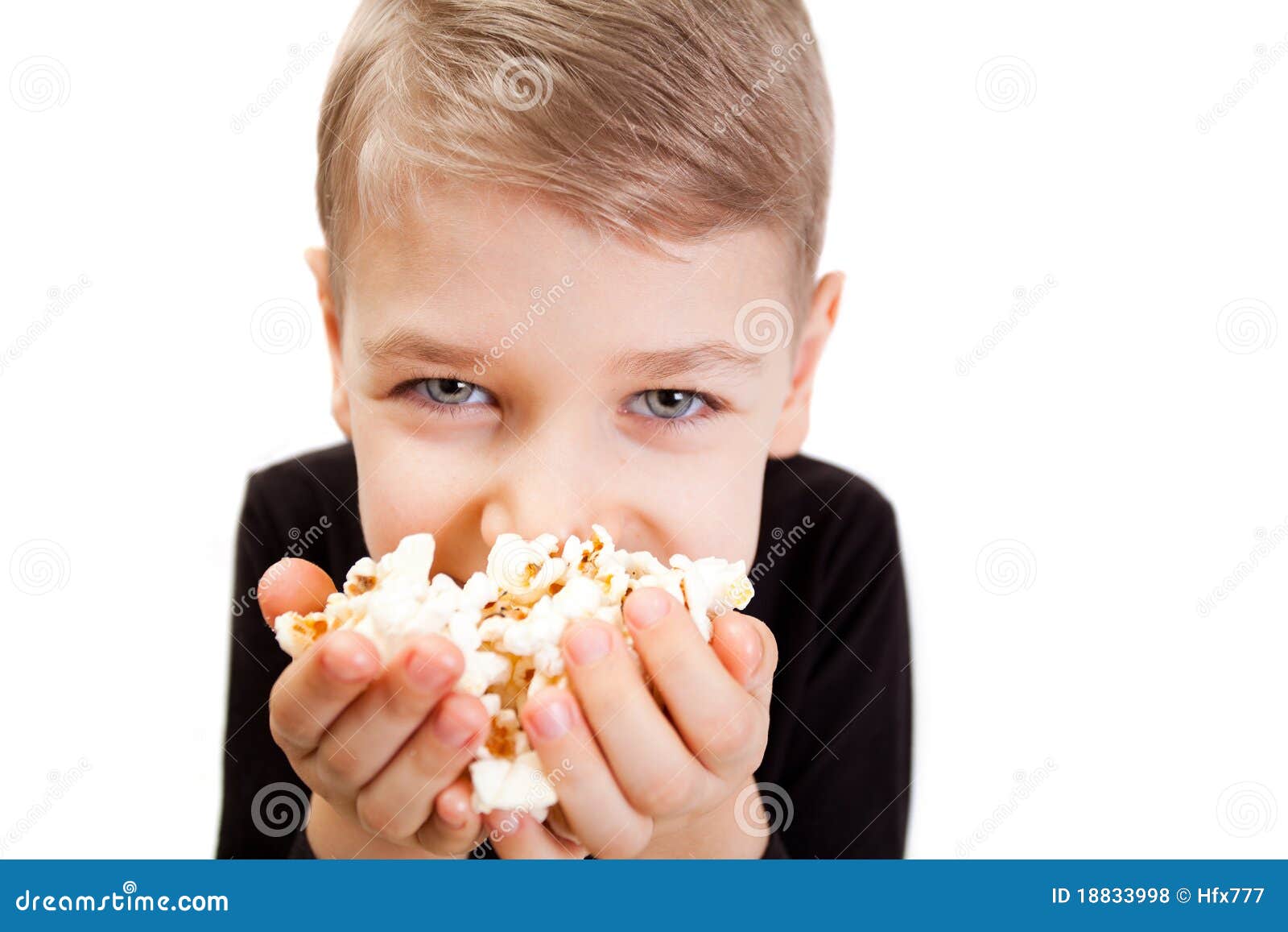 The boy eats popcorn stock photo. Image of happiness - 18833998