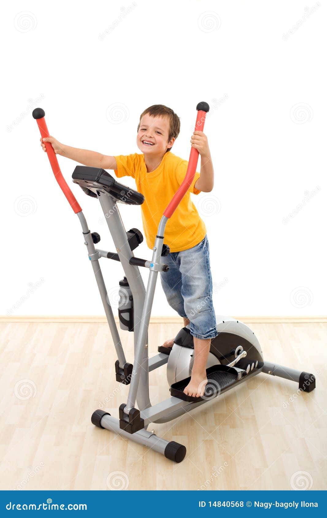 Boy on Elliptical Trainer Laughing Stock Photo - Image of caucasian ...