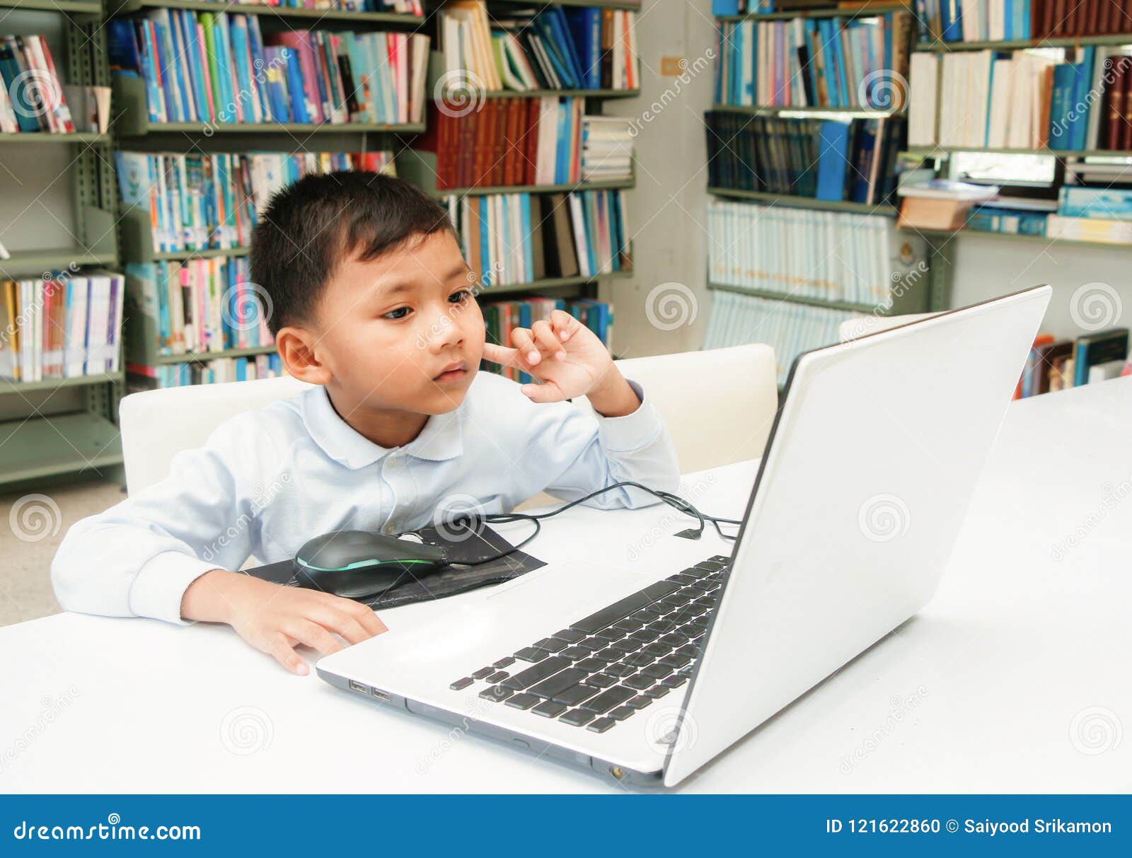 A boy enjoy with computer. stock photo. Image of sitting - 121622860