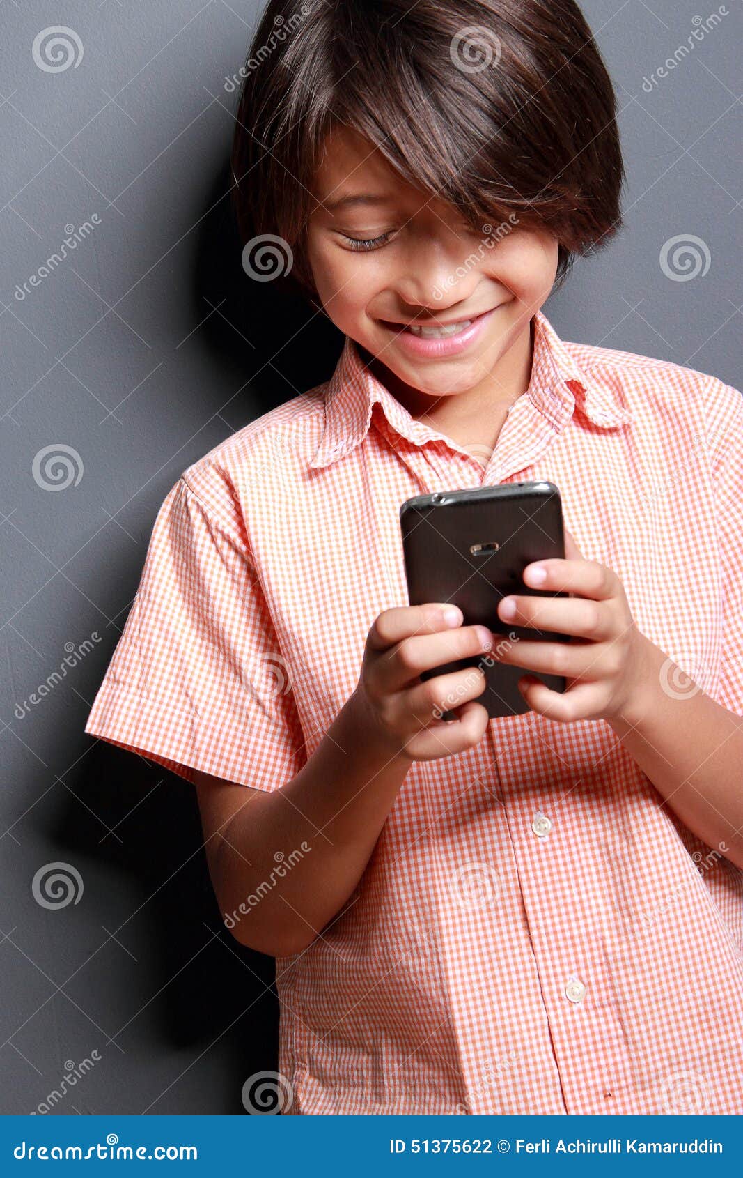 Boy Enjoy Playing a Mobilephone Stock Photo - Image of long, people ...