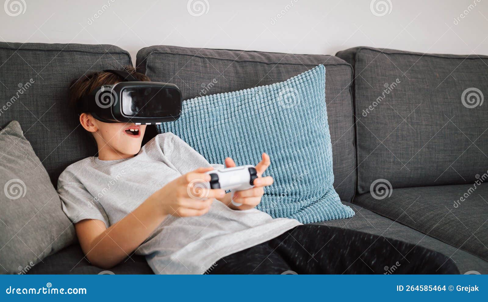 Boy Enjoying at Home, Gaming Using VR Goggles and a Simulator Stock ...