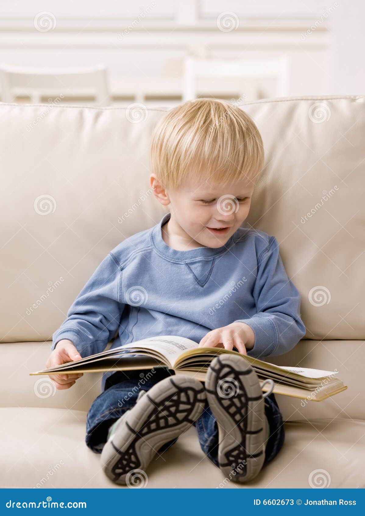 Boy Enjoying Reading a Book Stock Image - Image of book, people: 6602673