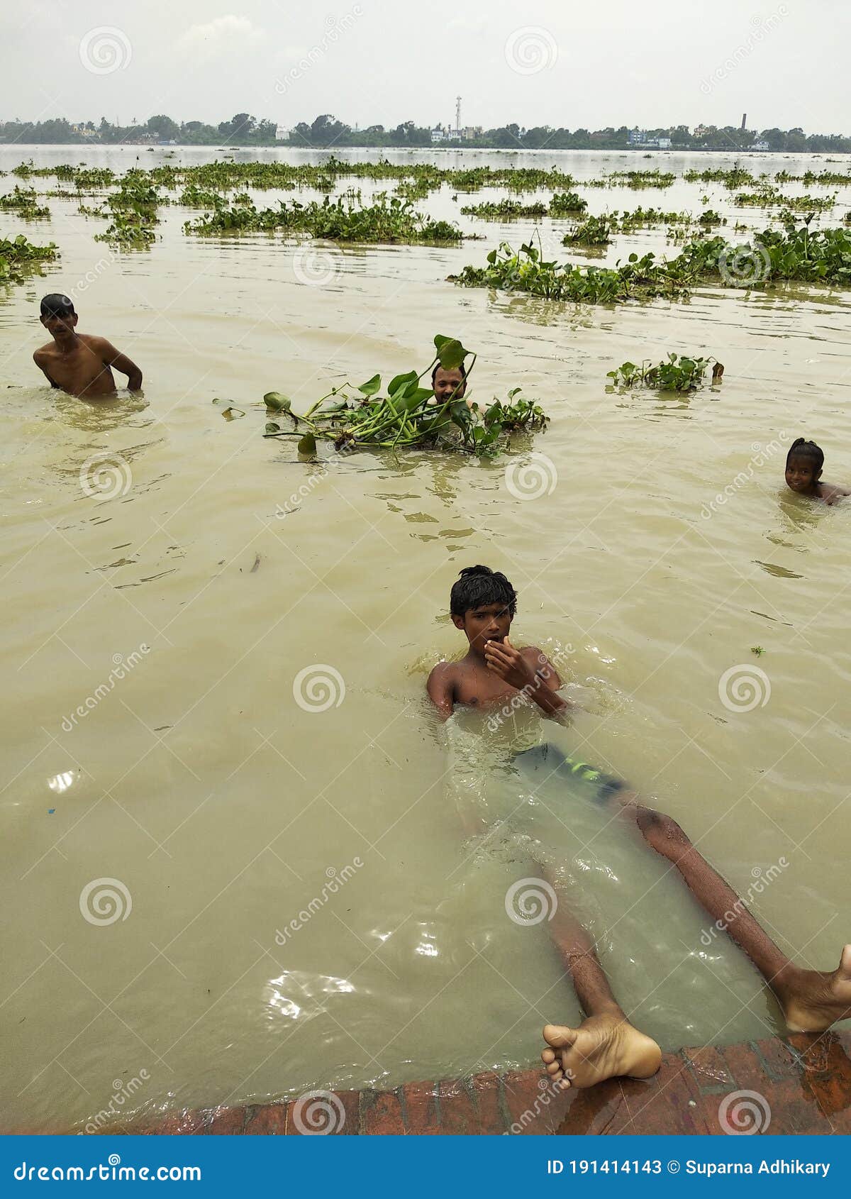 A Boy is Enjoying and Swimming into the River Editorial Stock Photo ...