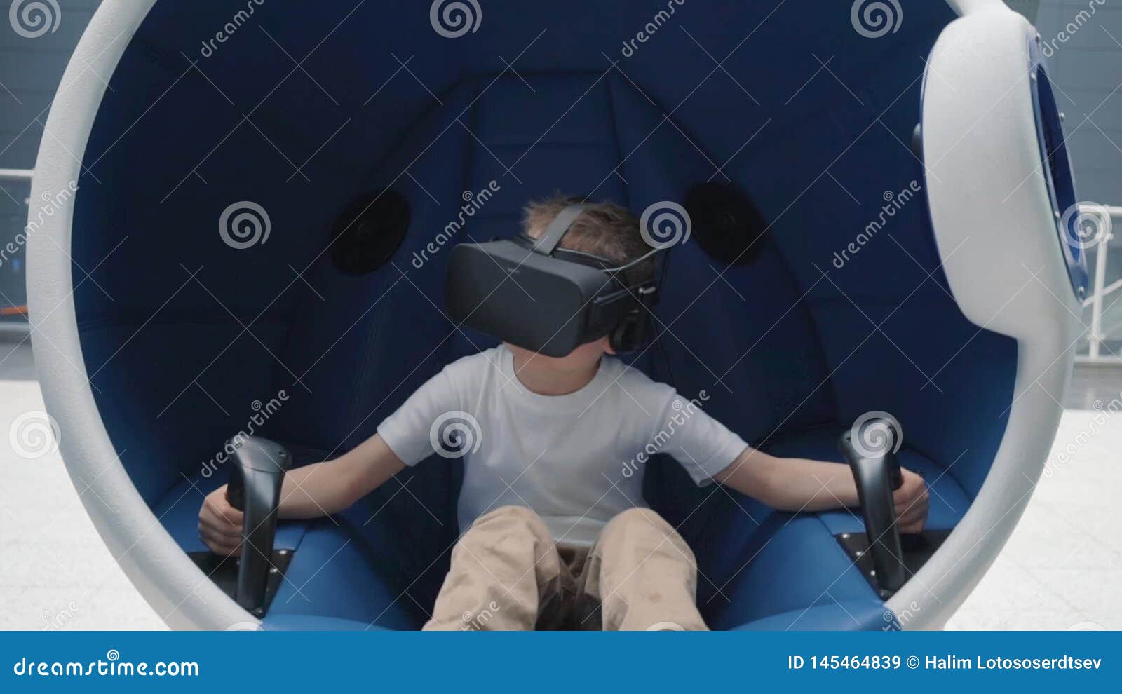 Boy Enjoying Virtual Reality Attraction Using VR Headset in a Moving ...