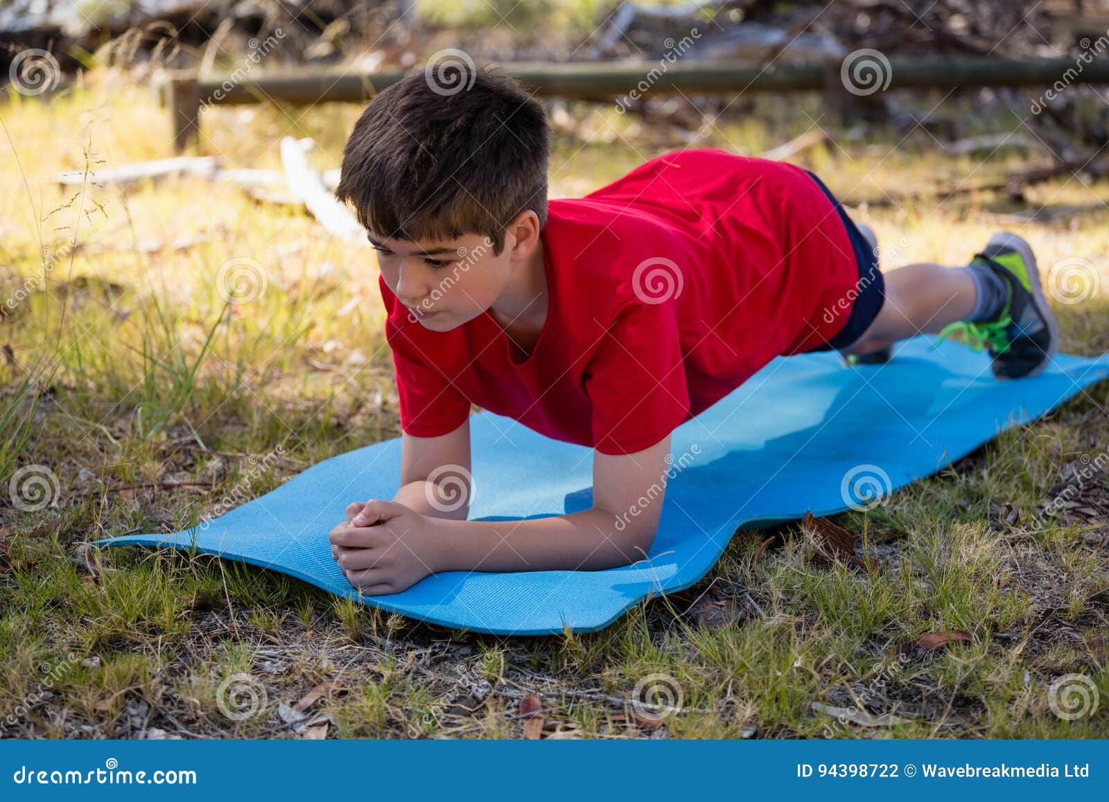 Boy Exercising on Exercise Mat during Obstacle Course Training Stock ...