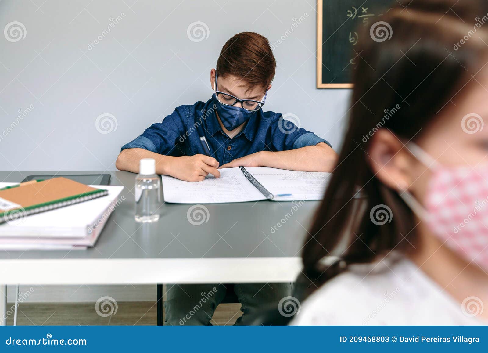Boy with Face Mask Writing at School Stock Image - Image of coronavirus ...