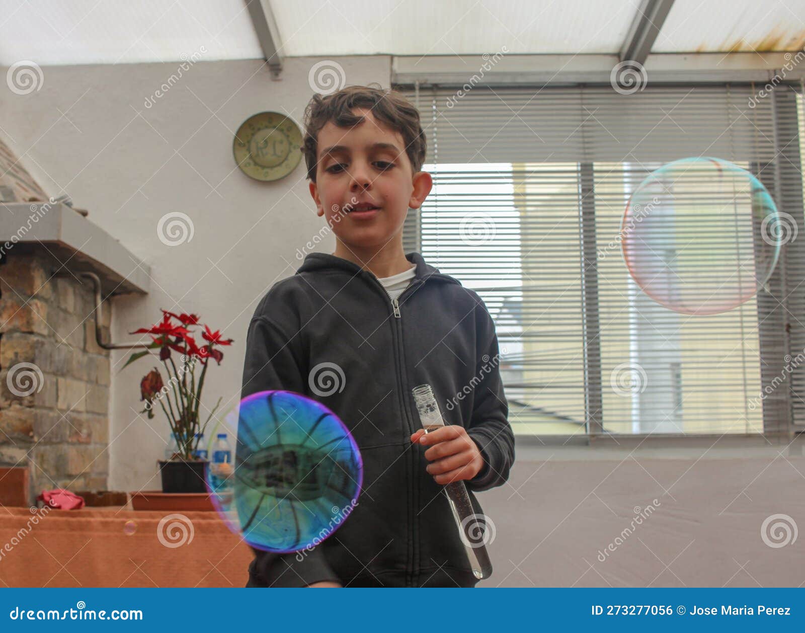 Boy Fascinated by Bubbles at Home Stock Photo - Image of soap ...