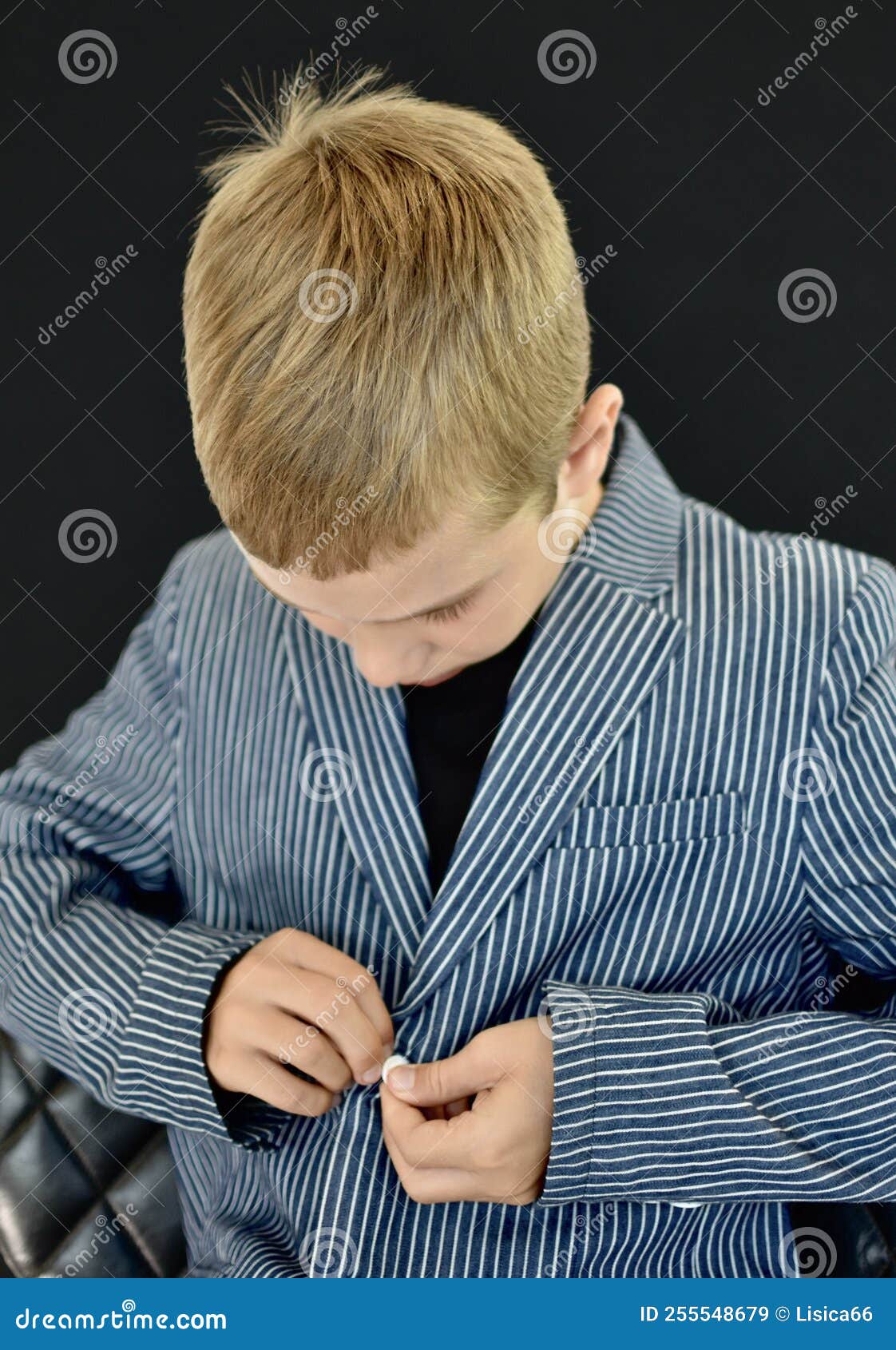 Boy Fastening a Button on His Jacket Stock Image - Image of child, male ...