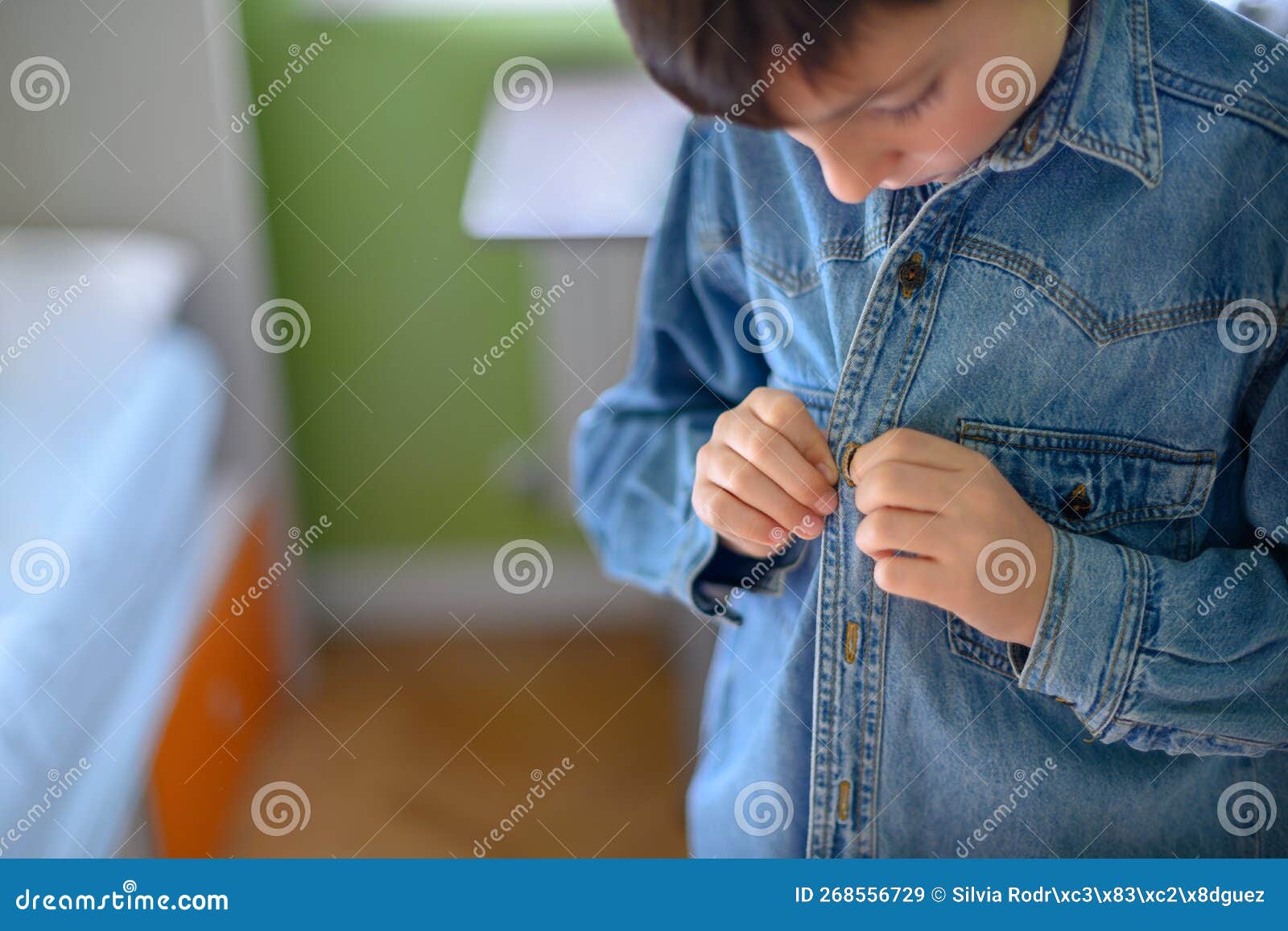 Boy Fastens the Button of a Denim Shirt Stock Image - Image of clothing ...